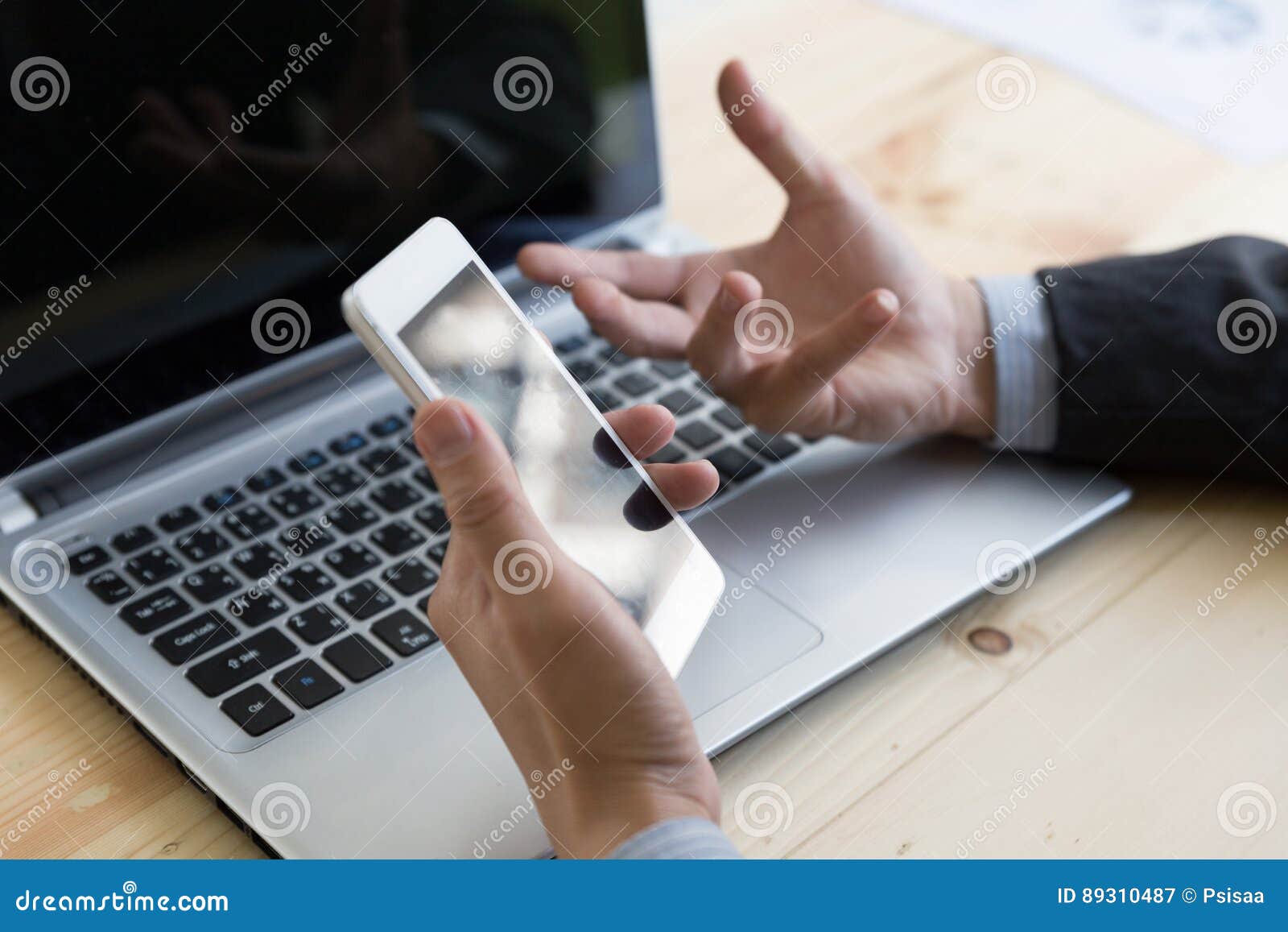 Businessman Using Smartphone and Laptop Computer in Office Stock Image ...