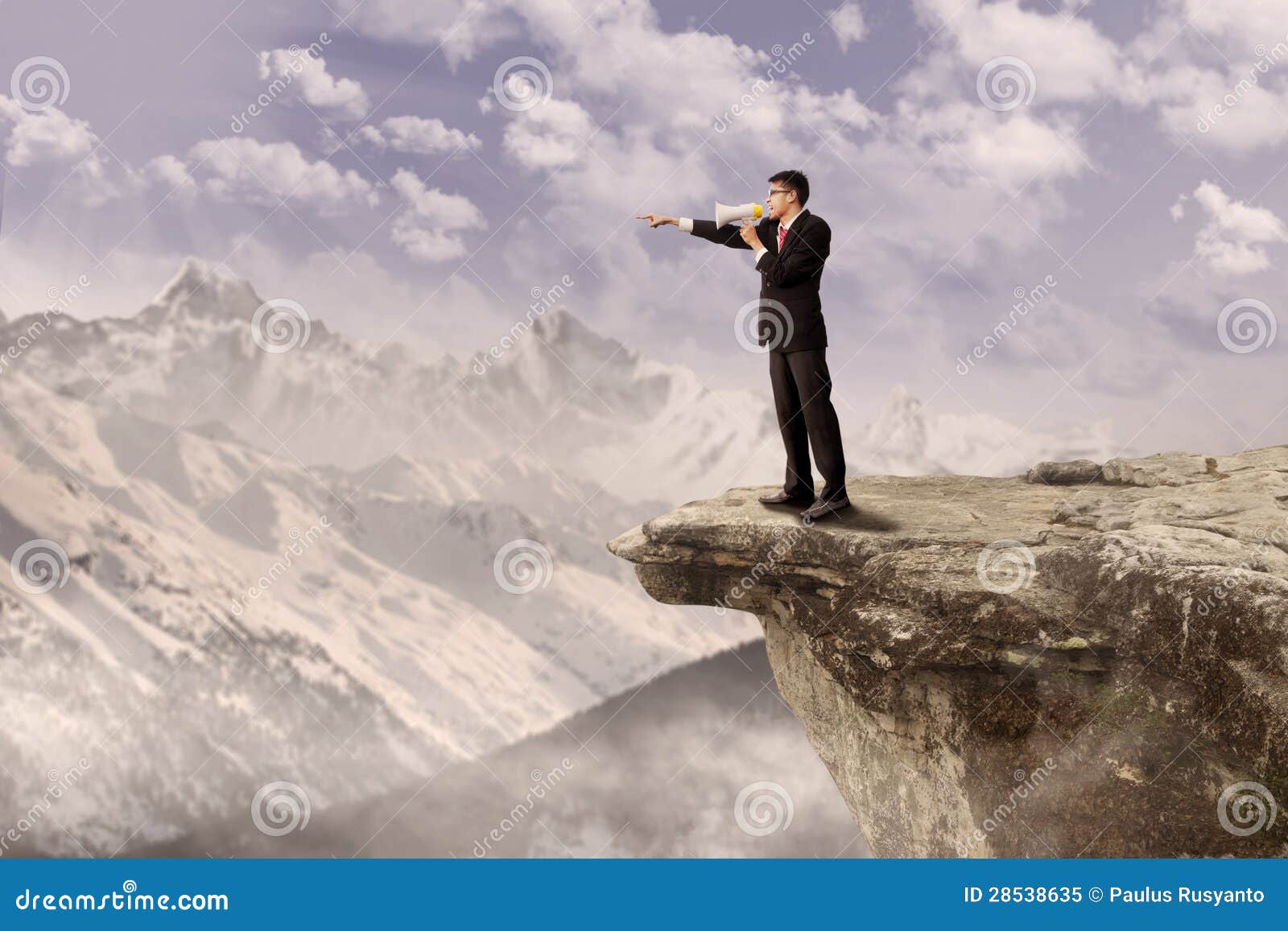 Businessman Using Speaker on Cliff Stock Image - Image of japanese ...