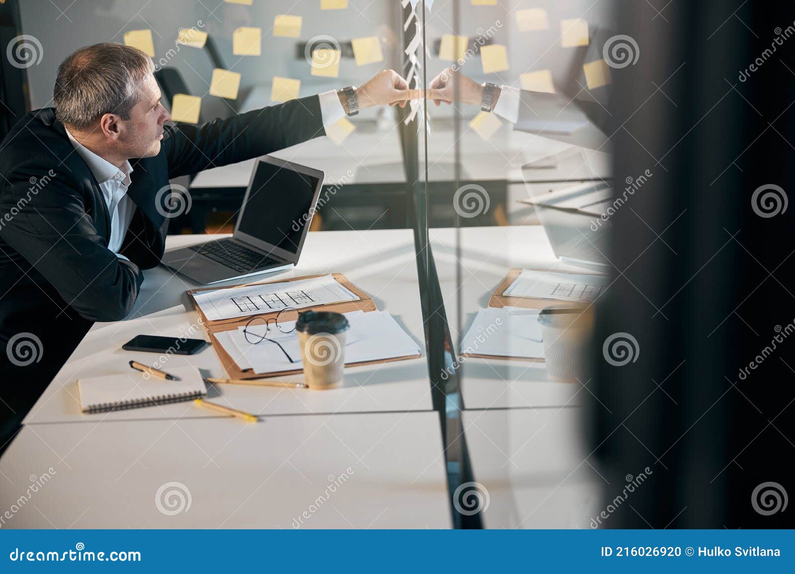 Businessman Using Sticky Notes in Modern Office Stock Photo - Image of ...