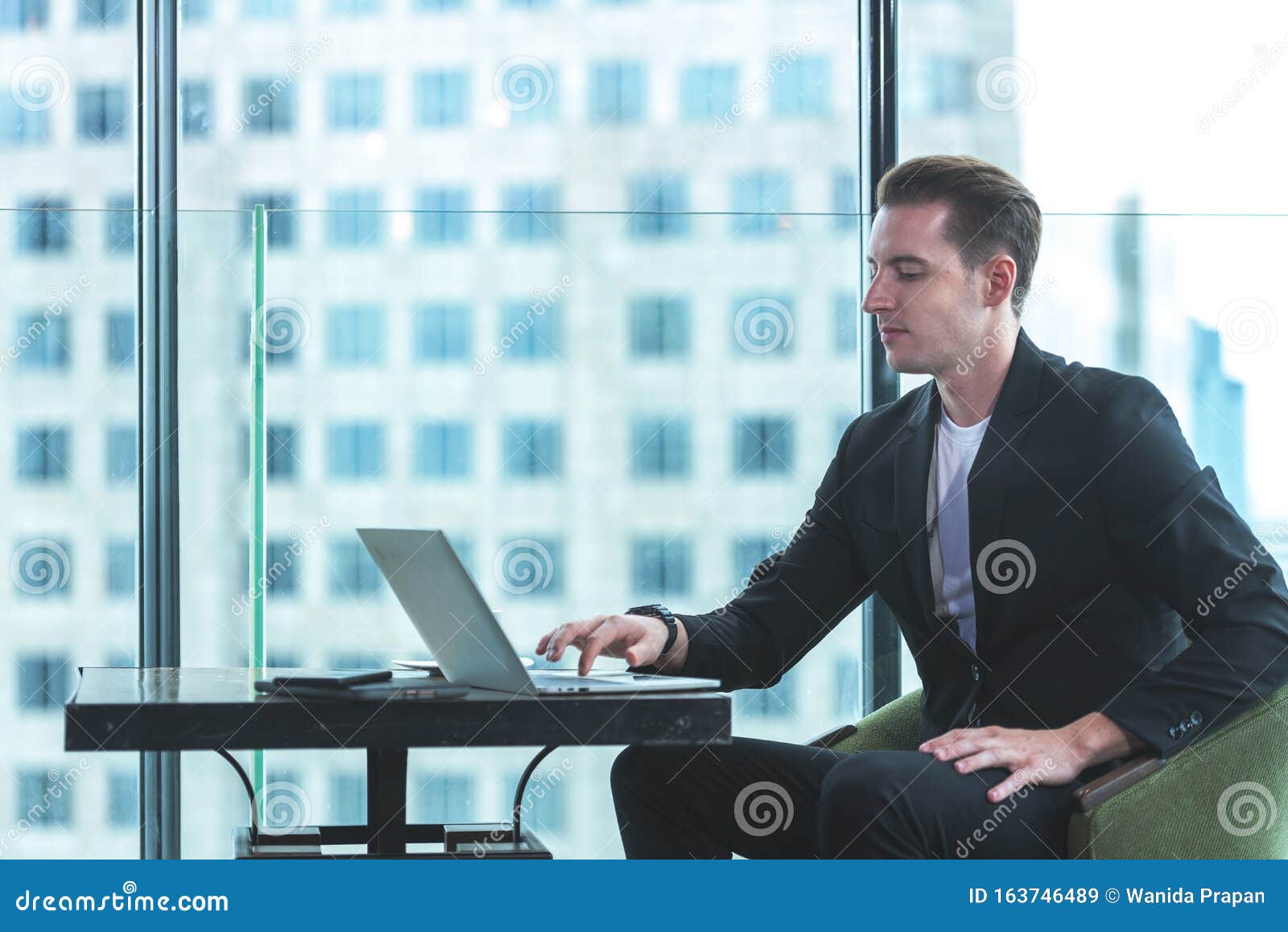 Businessman Using Tablet Computer To Work with Financial Data in the ...