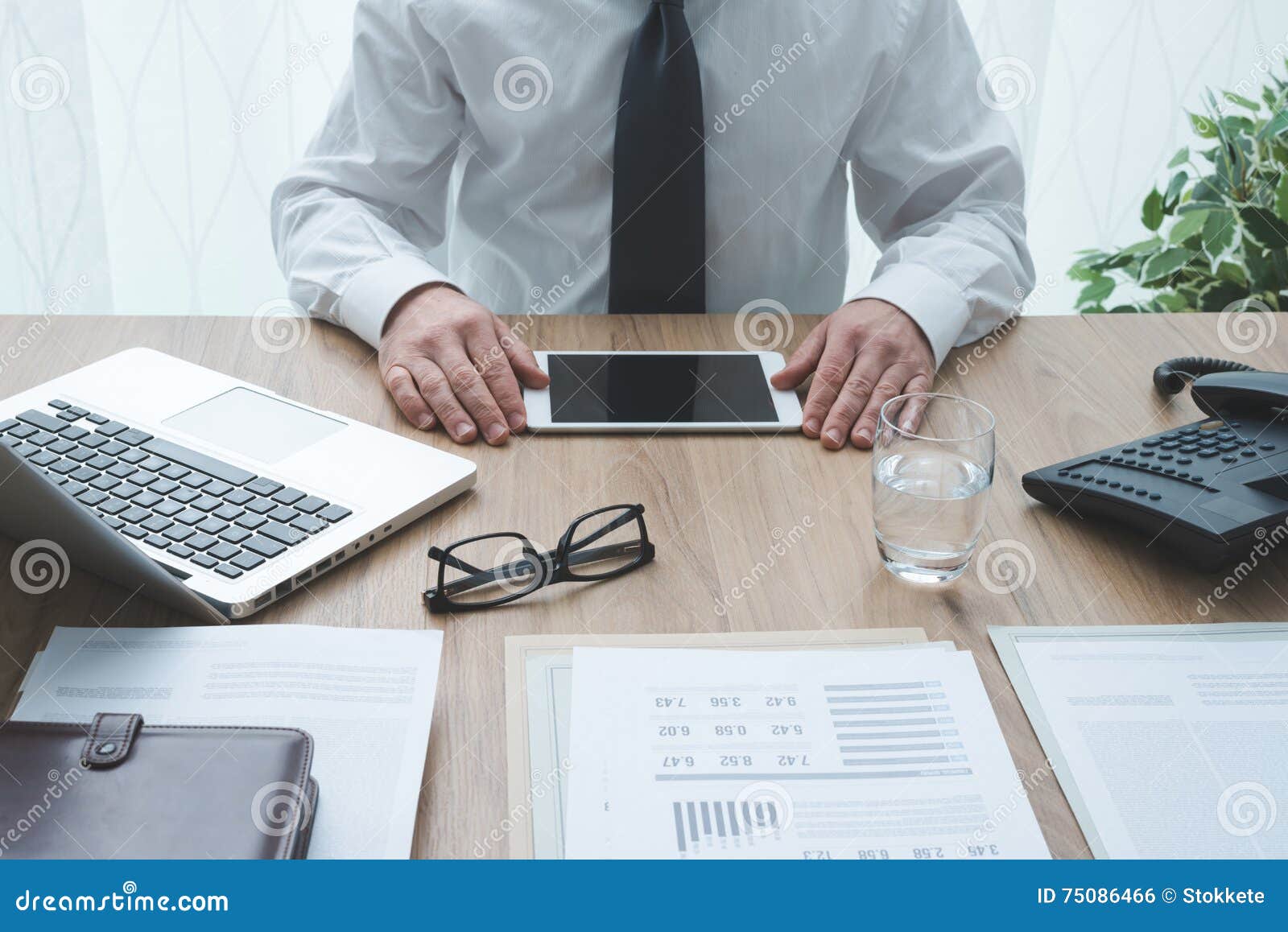 Businessman using a tablet stock photo. Image of shirt - 75086466