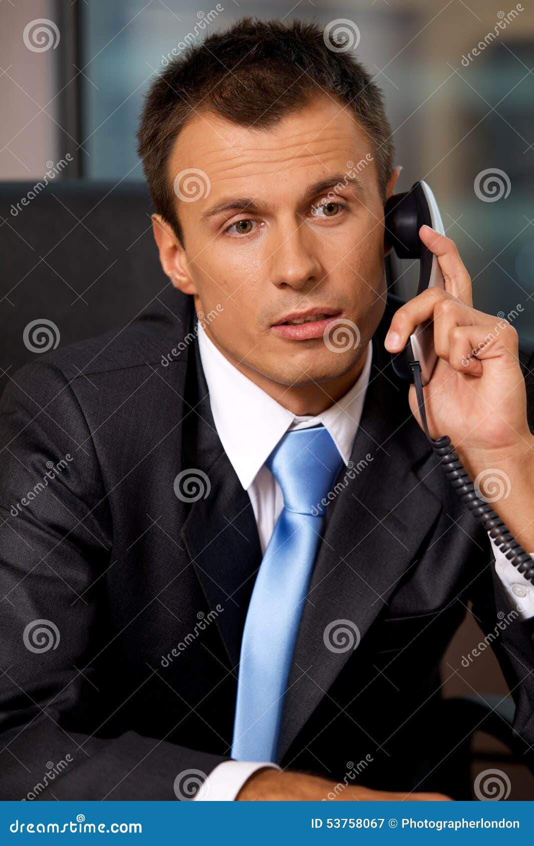 Businessman Using Telephone in an Office Stock Image - Image of phone ...