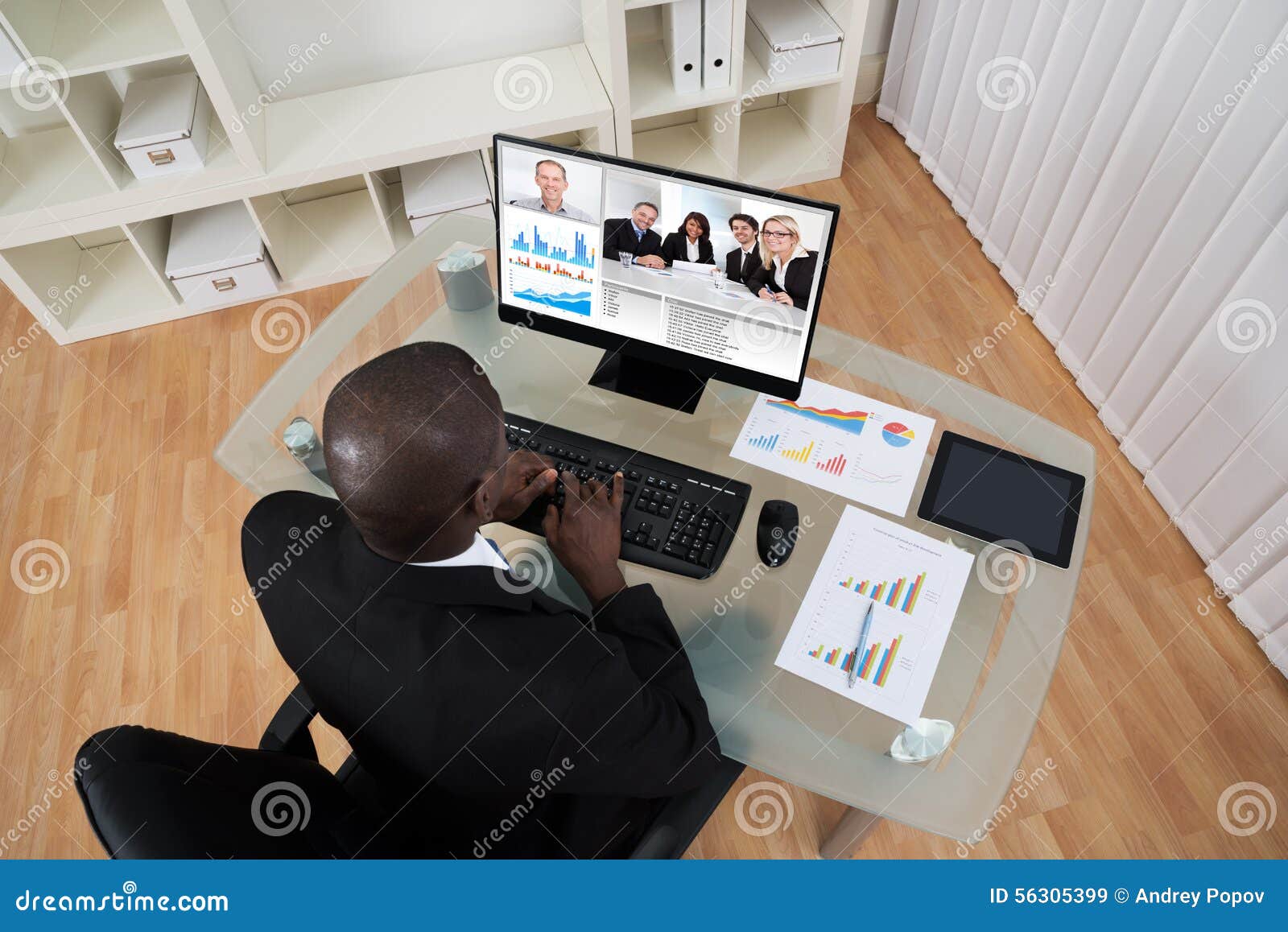 Businessman Video Conferencing with Colleague on Computer Stock Image ...