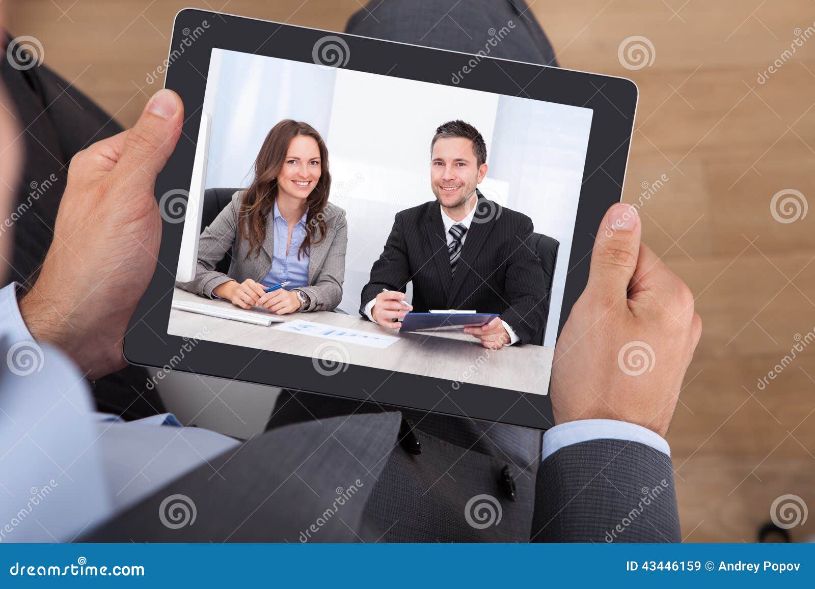 Businessman Video Conferencing with Colleagues on Digital Tablet Stock ...