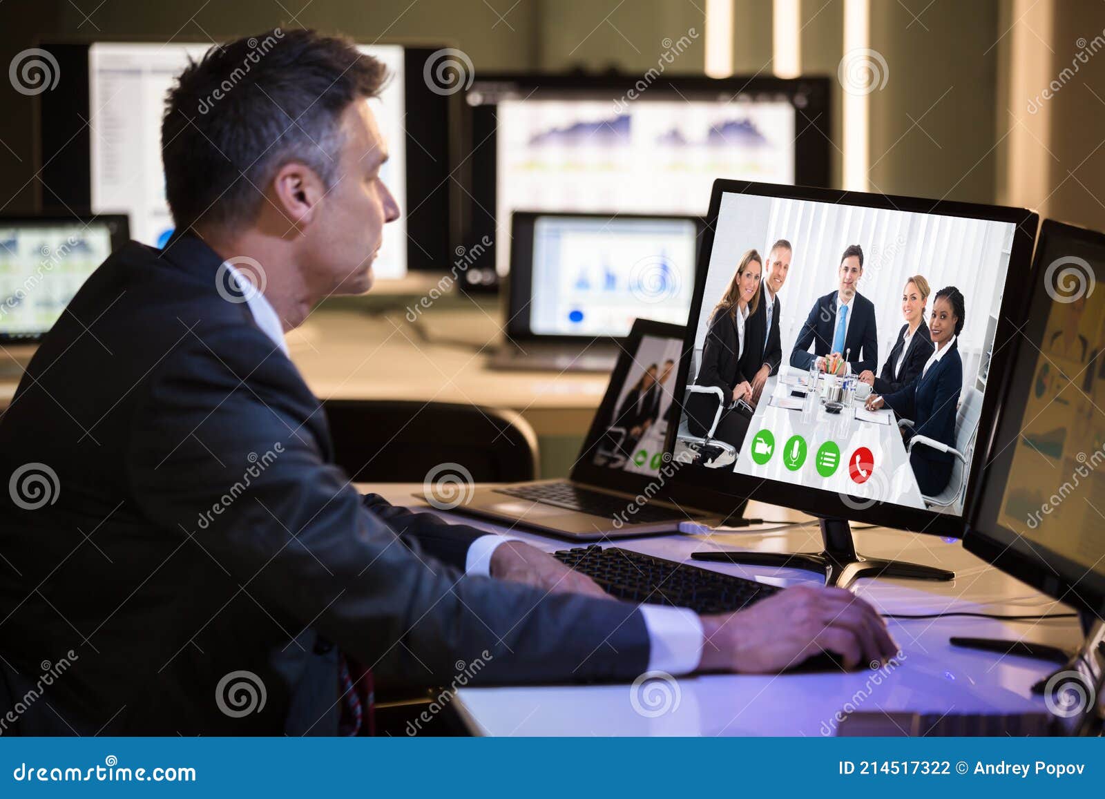 Businessman Video Conferencing with Happy Colleagues on Computer Stock ...