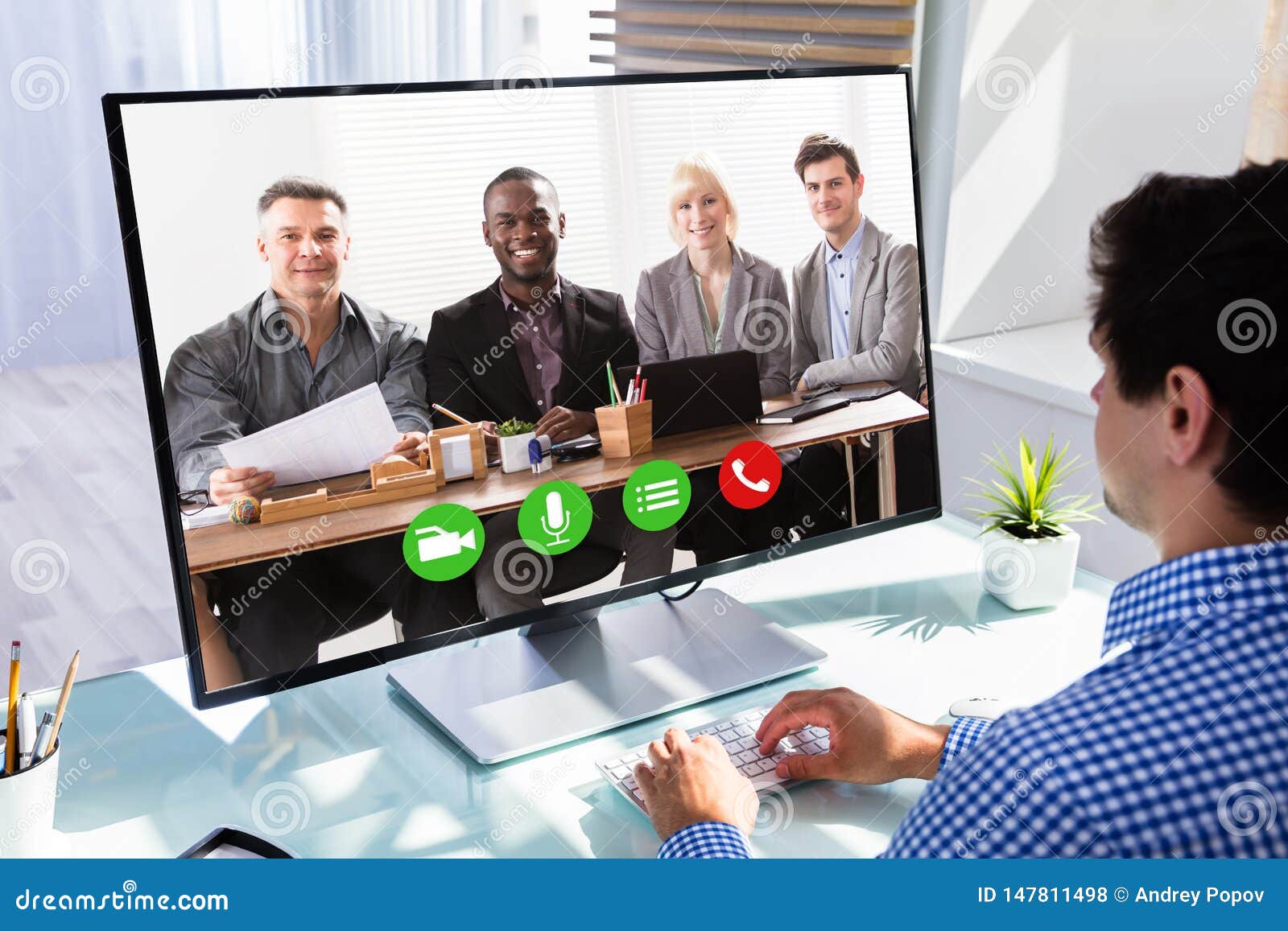 Businessman Videoconferencing with His Colleagues Stock Photo - Image ...