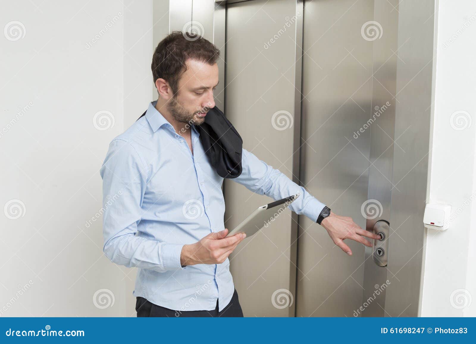 Businessman Waiting for the Elevator Stock Image - Image of modern ...