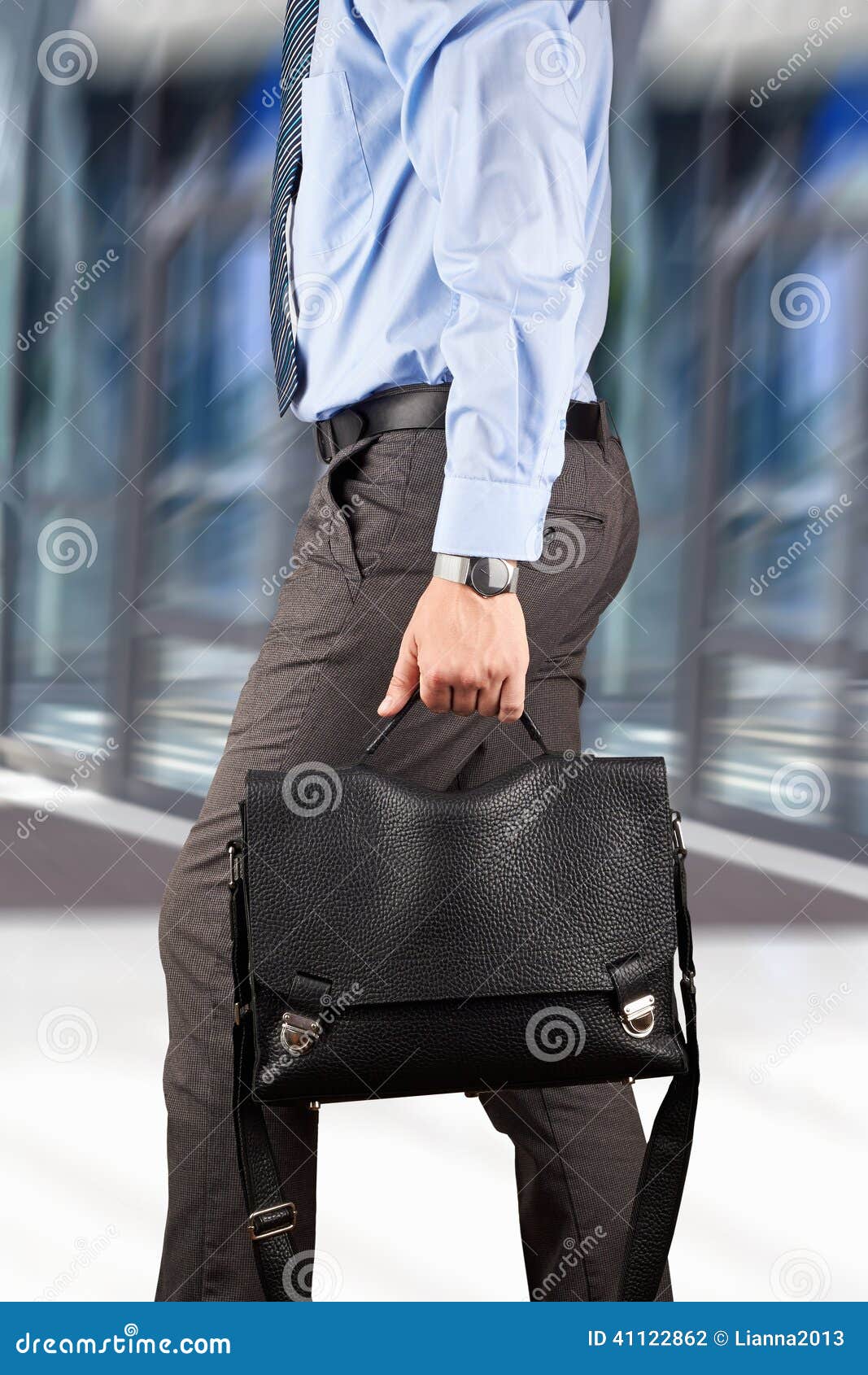 Businessman Walking and Holding a Leather Briefcase in His Han Stock ...
