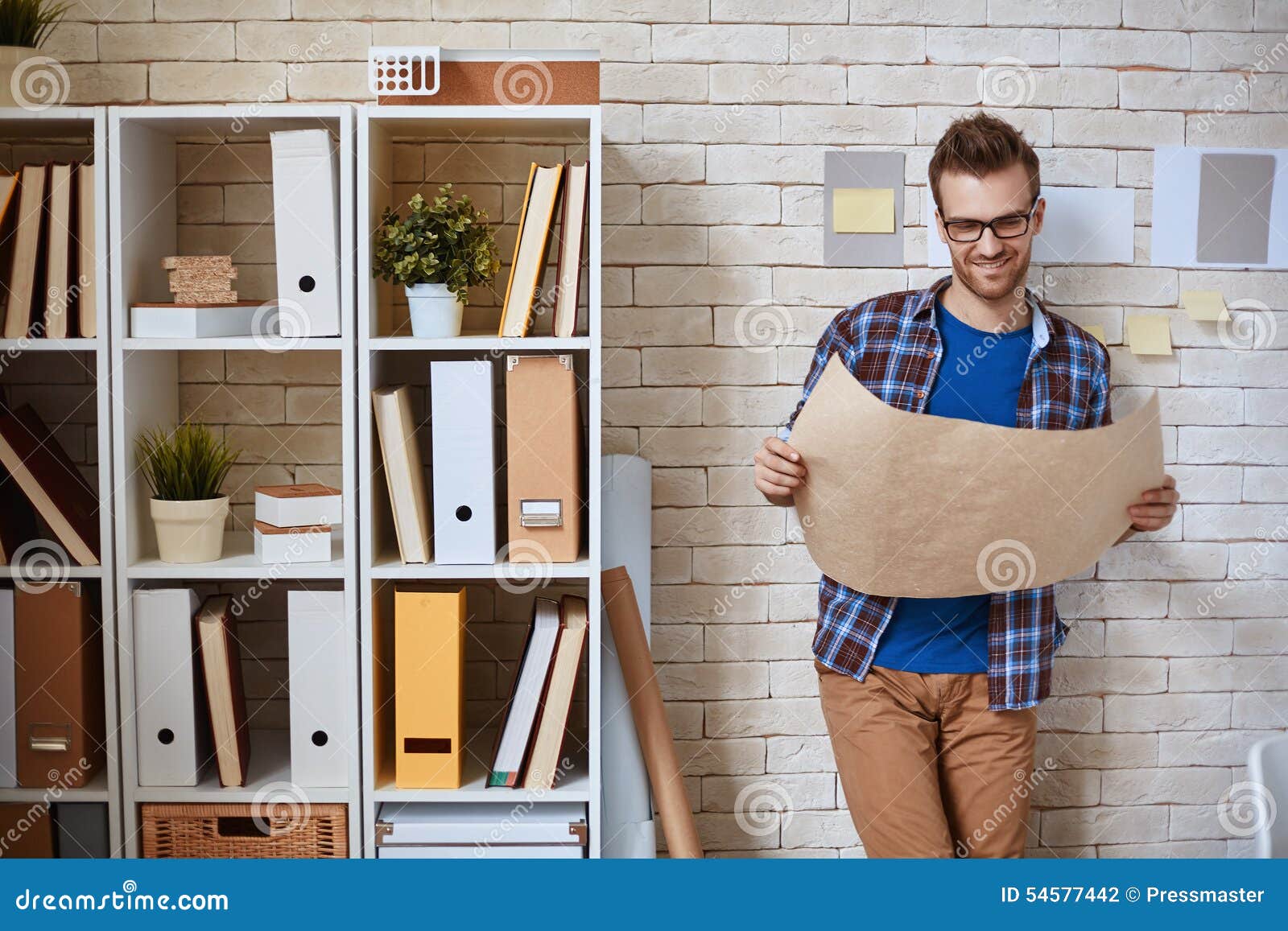 Businessman by the wall stock photo. Image of busy, working - 54577442