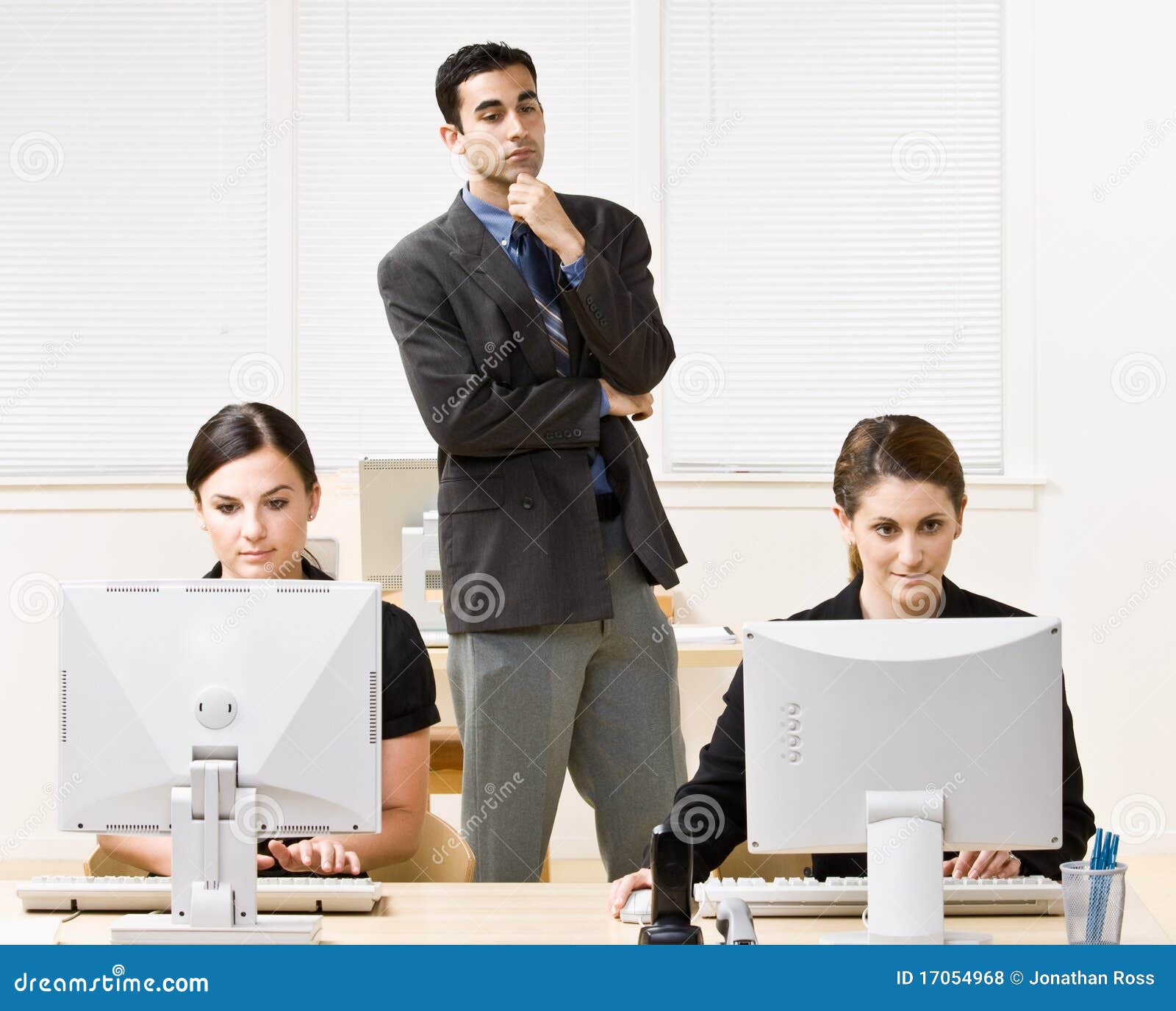 Businessman Watching Co-workers Work Stock Photo - Image of business ...