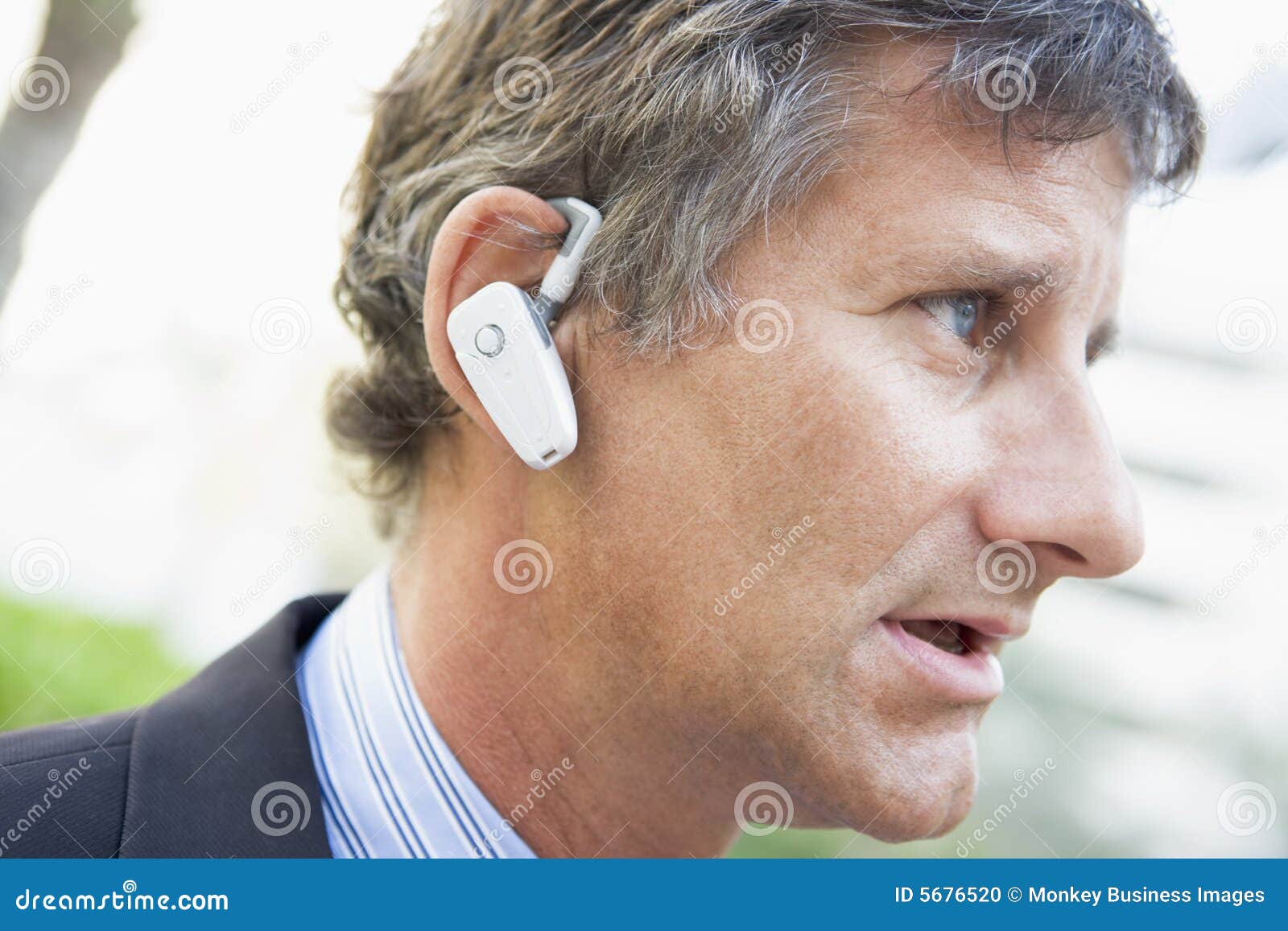 Businessman Wearing Earpiece Outdoors Stock Photo - Image of earpiece ...