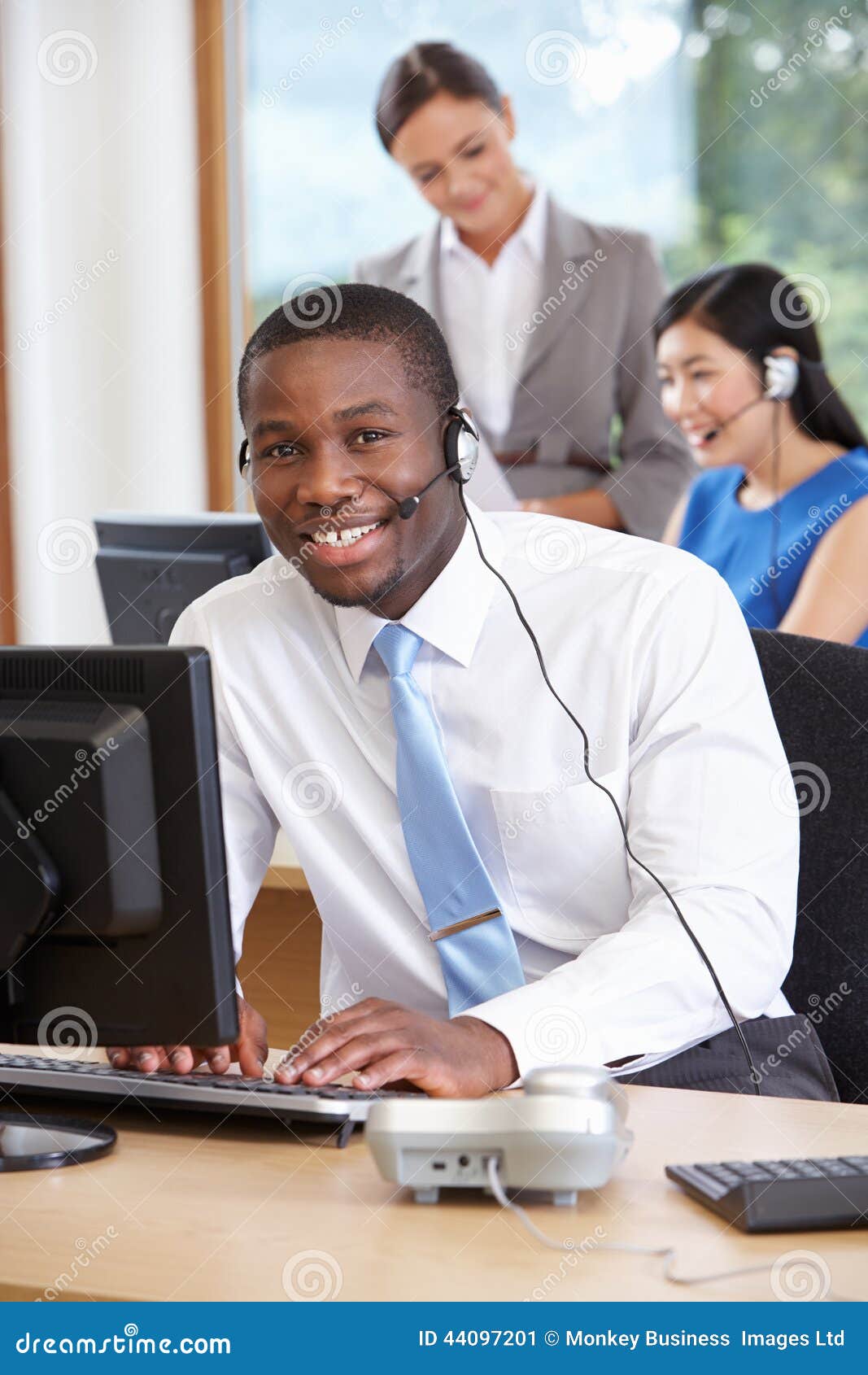 Businessman Wearing Headset Working in Busy Office Stock Image - Image ...