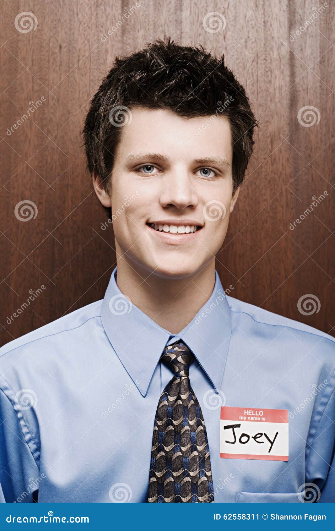 Businessman Wearing Name Tag Stock Image - Image of indoors, confident ...