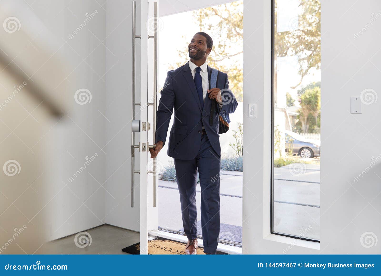 Businessman Wearing Suit Opening Door Returning Home from Work Stock ...