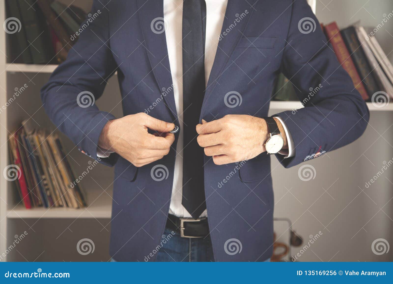 Businessman wears a jacket stock photo. Image of suit - 135169256