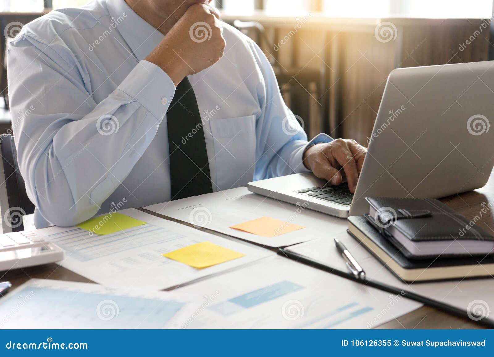 Businessman Work with Computer on Table in Office Work with Paper Graph ...