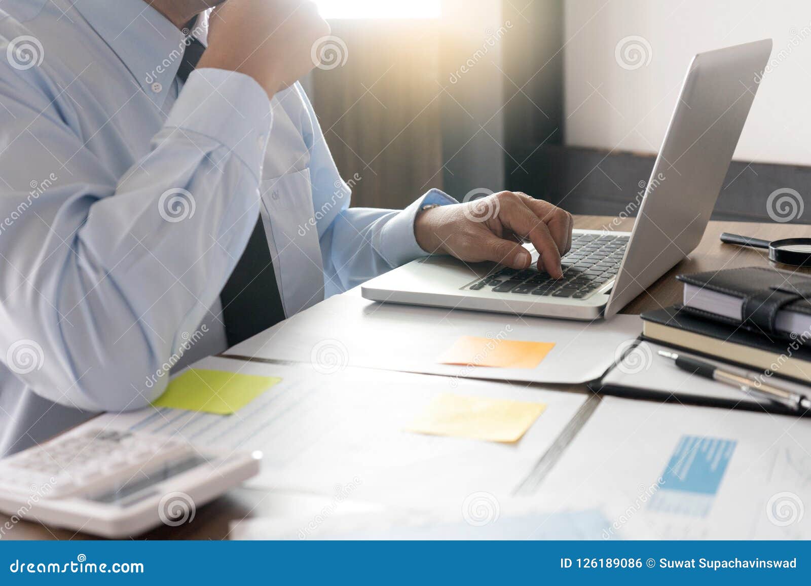 Businessman Work with Computer on Table in Office Work with Paper Graph ...