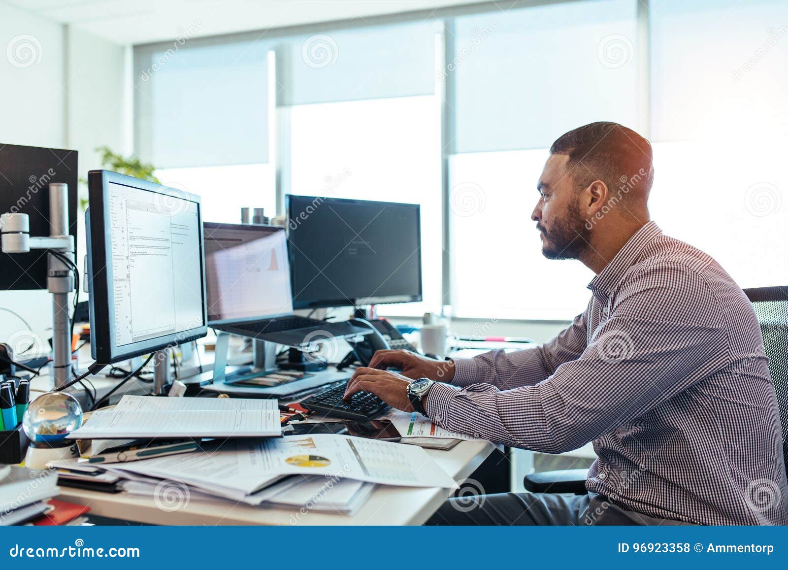 Businessman Working on Computer at His Desk in Office. Stock Photo ...