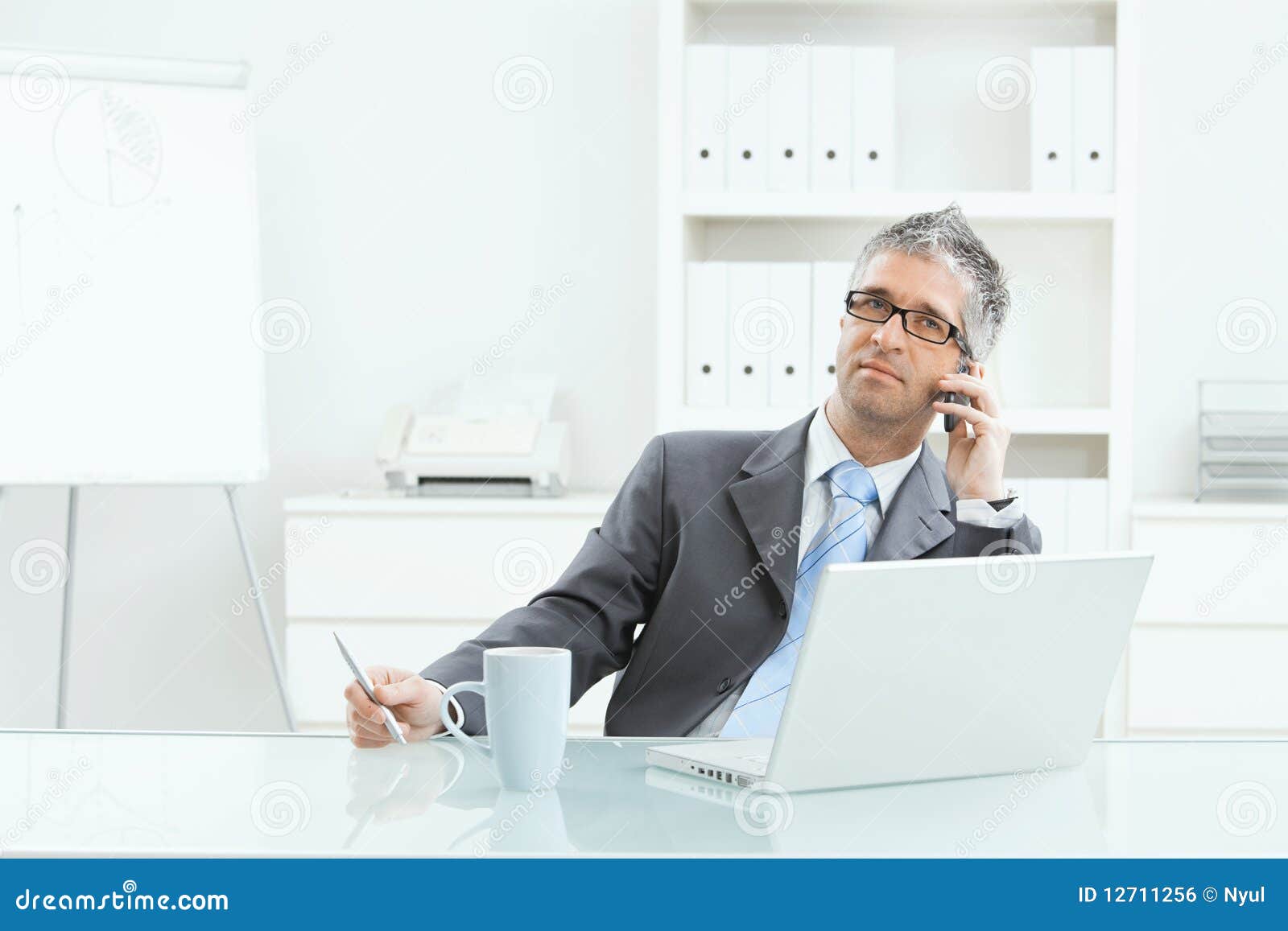 Businessman Working at Desk Stock Photo - Image of laptop, leading ...