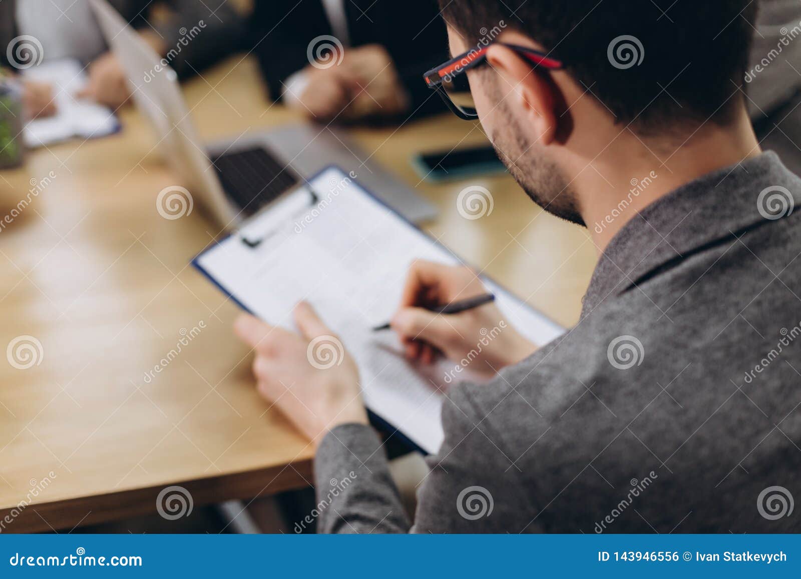 Businessman Working with Documents in Modern Office. Back View Stock ...