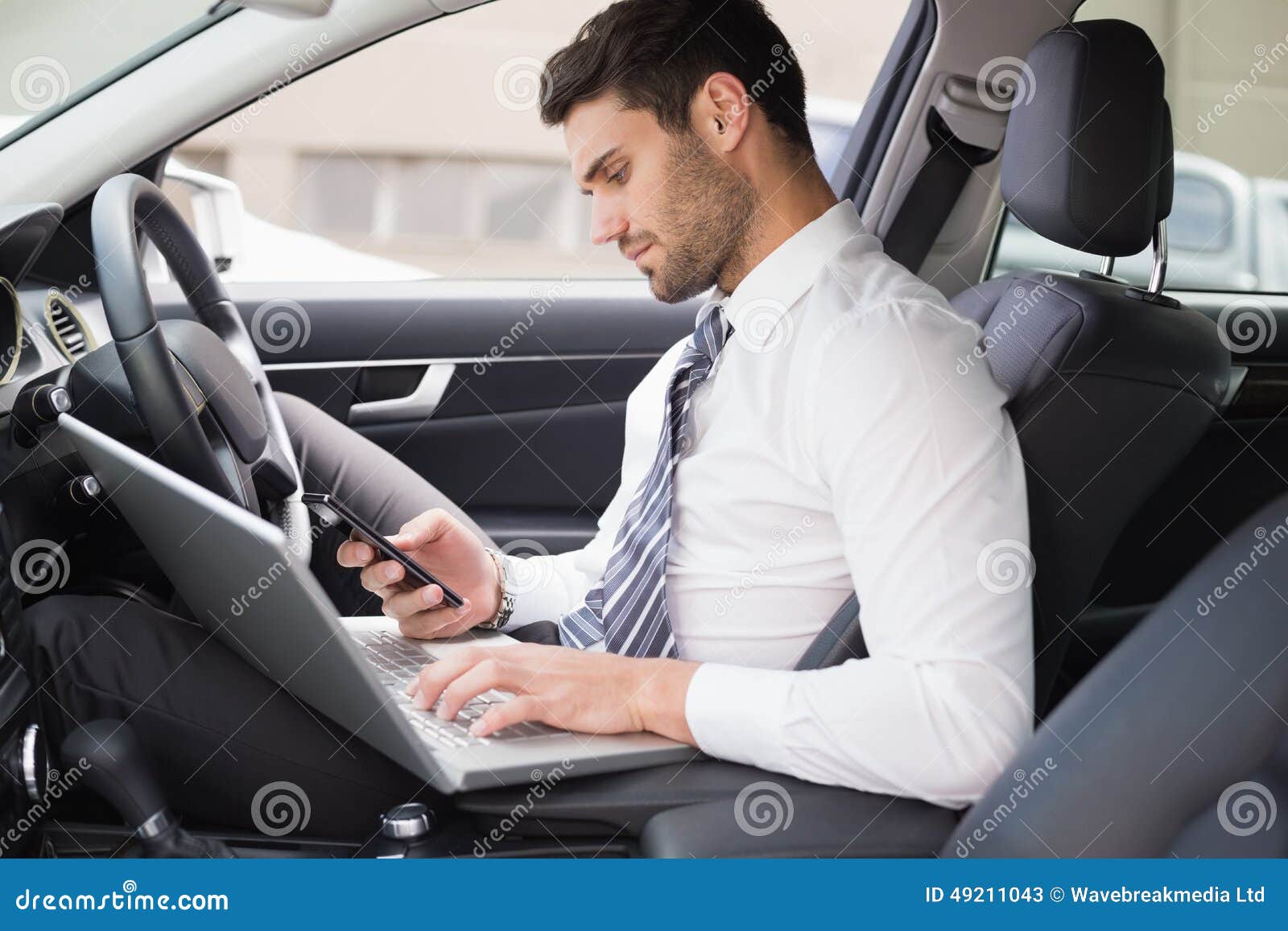 Businessman Working in the Drivers Seat Stock Image - Image of ...