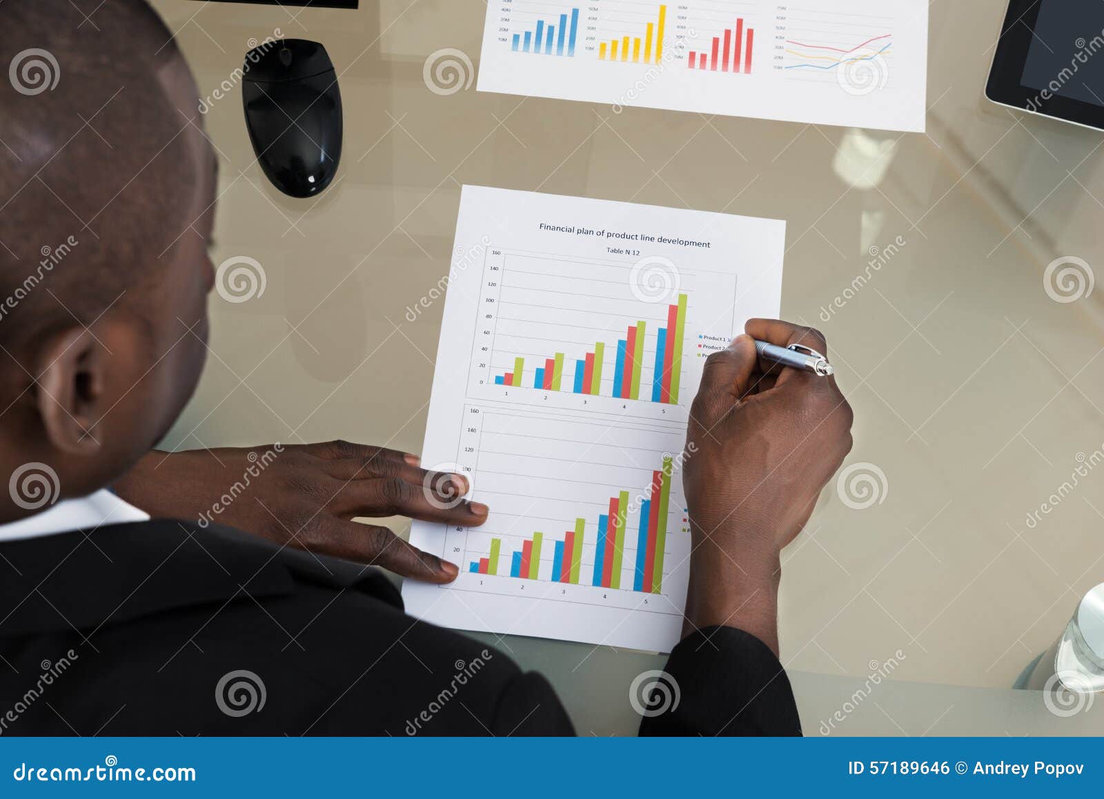 Businessman Working with Graph at Desk Stock Photo - Image of indoor ...