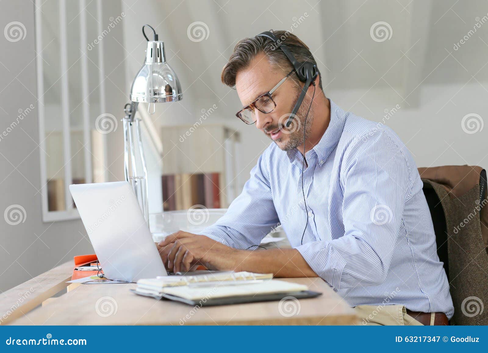 Businessman Working with Headset on Laptop Stock Image - Image of ...