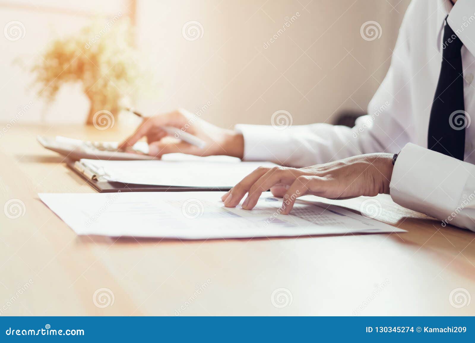 Businessman Working at His Office with Documents and Check the Accuracy ...