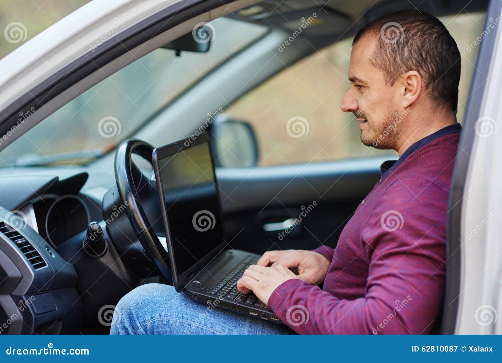 Businessman Working on a Laptop in Car Stock Image - Image of handsome ...