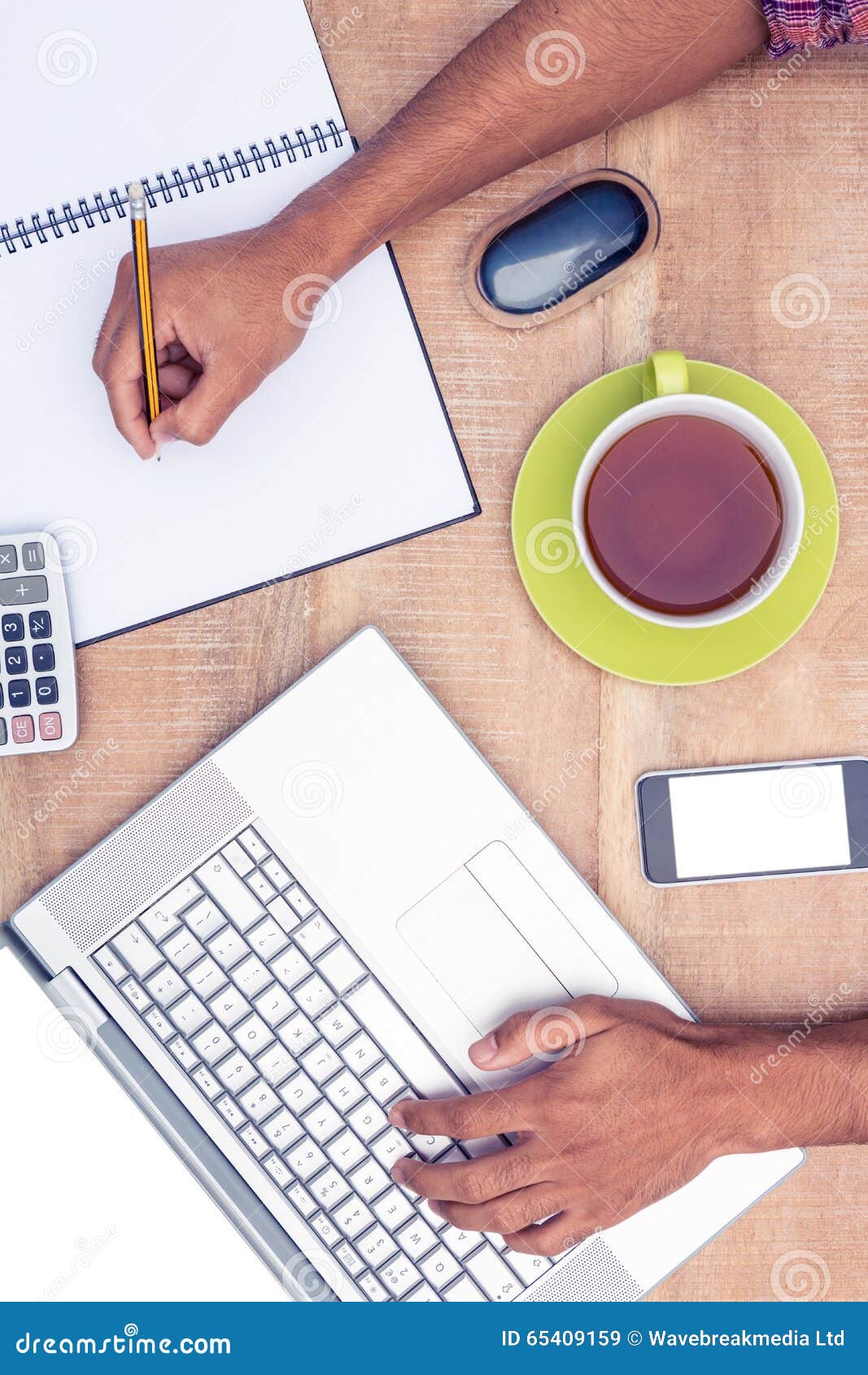 Businessman Working on Laptop while Writing on Book Stock Image - Image ...