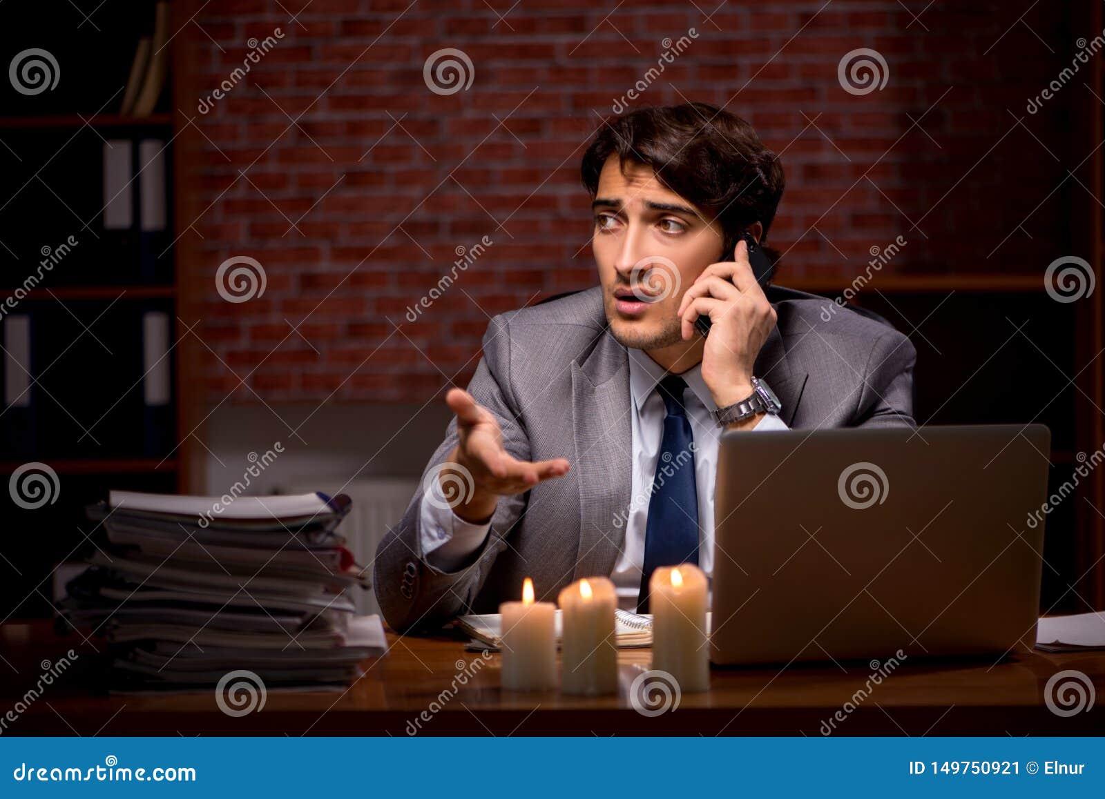 Businessman Working Late in Office with Candle Light Stock Image ...