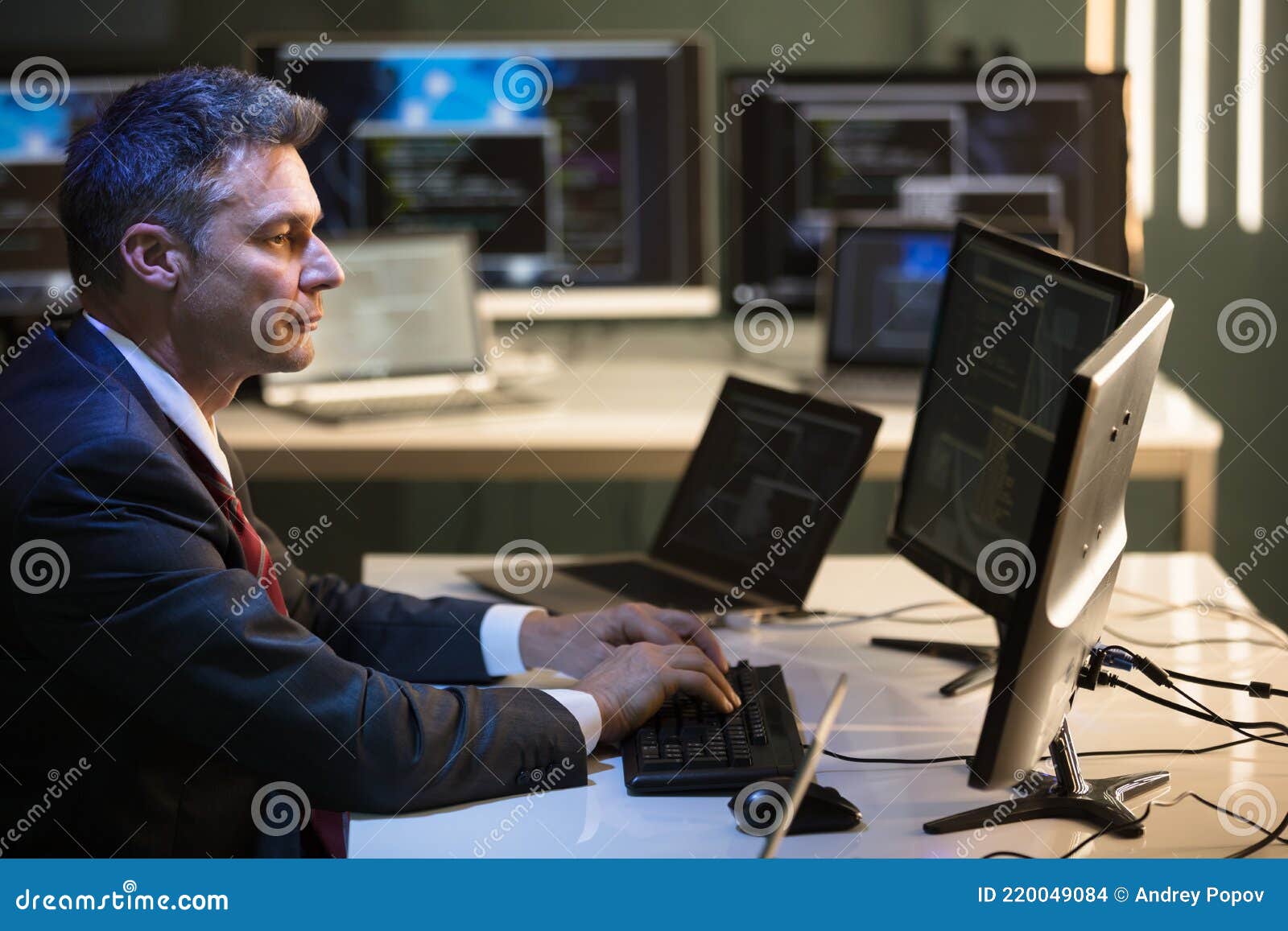 Businessman Working on Multiple Computers Stock Photo - Image of ...