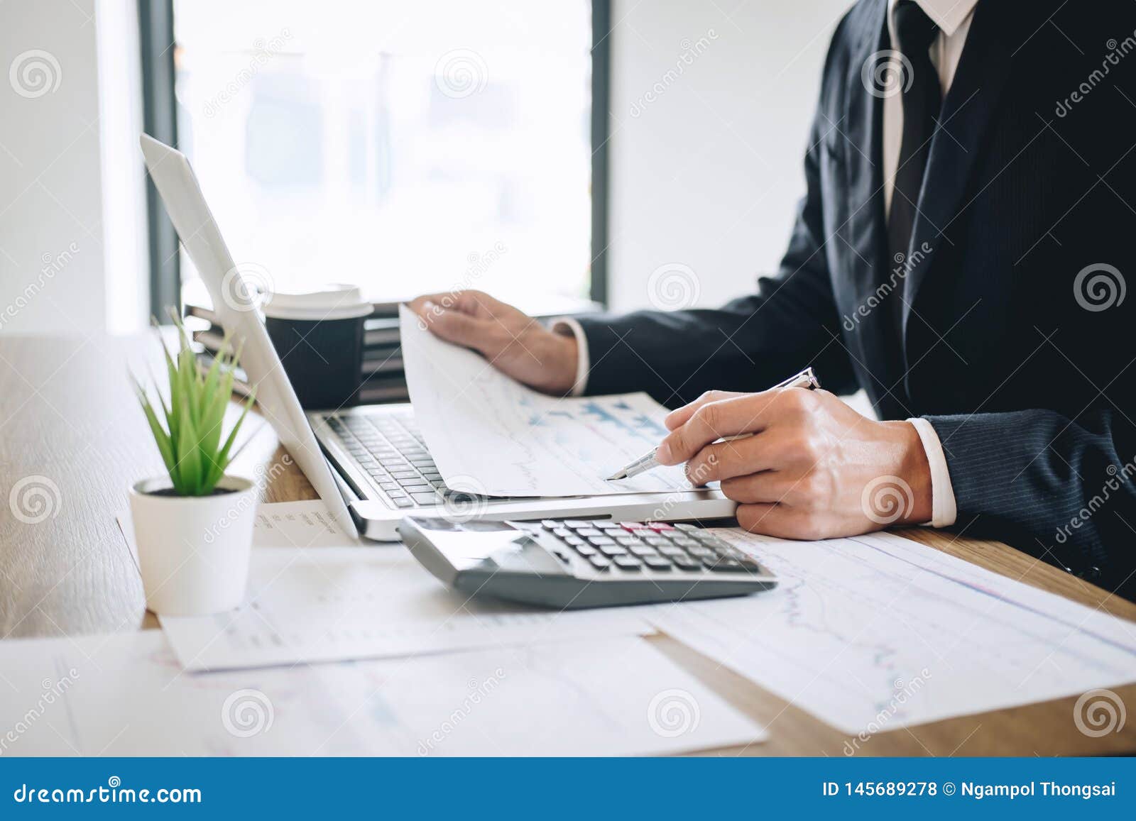 Businessman Working New Project on Laptop Computer with Report Document ...