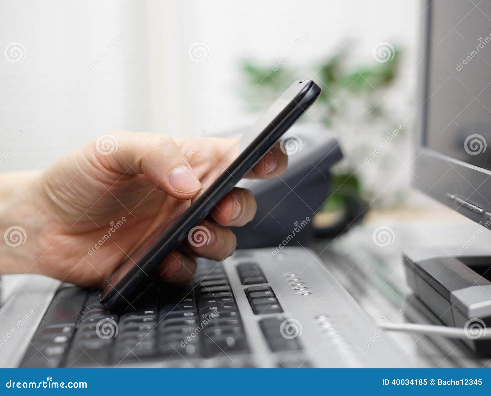 Businessman Working in Office with Mobile Phone and Computer Stock ...