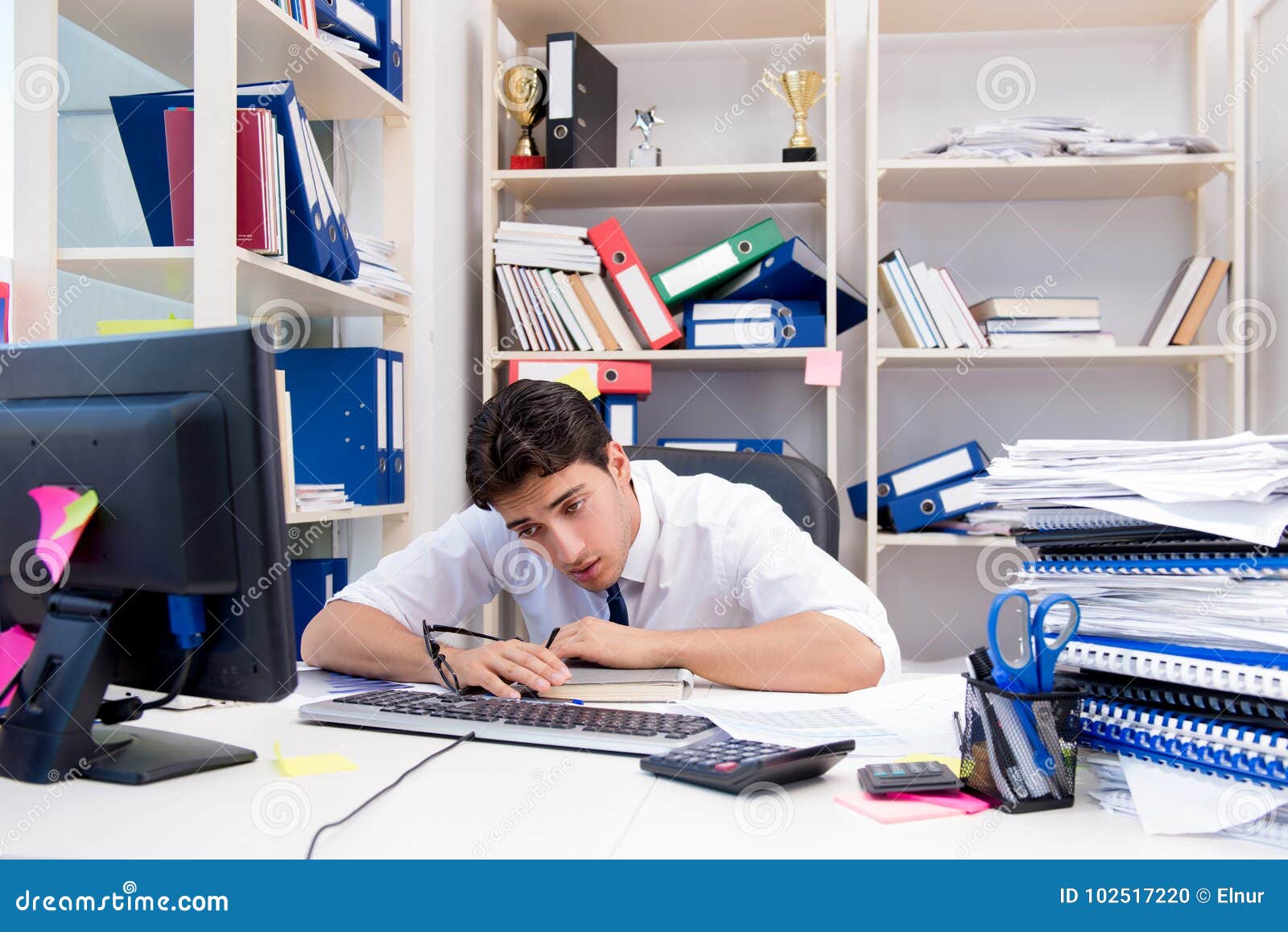 Businessman Working in the Office with Piles of Books and Papers Stock ...