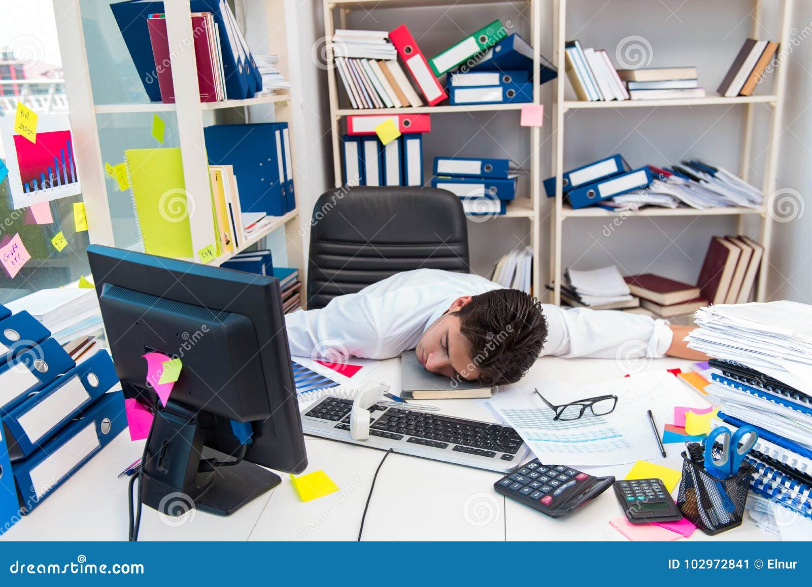 Businessman Working in the Office with Piles of Books and Papers Stock ...