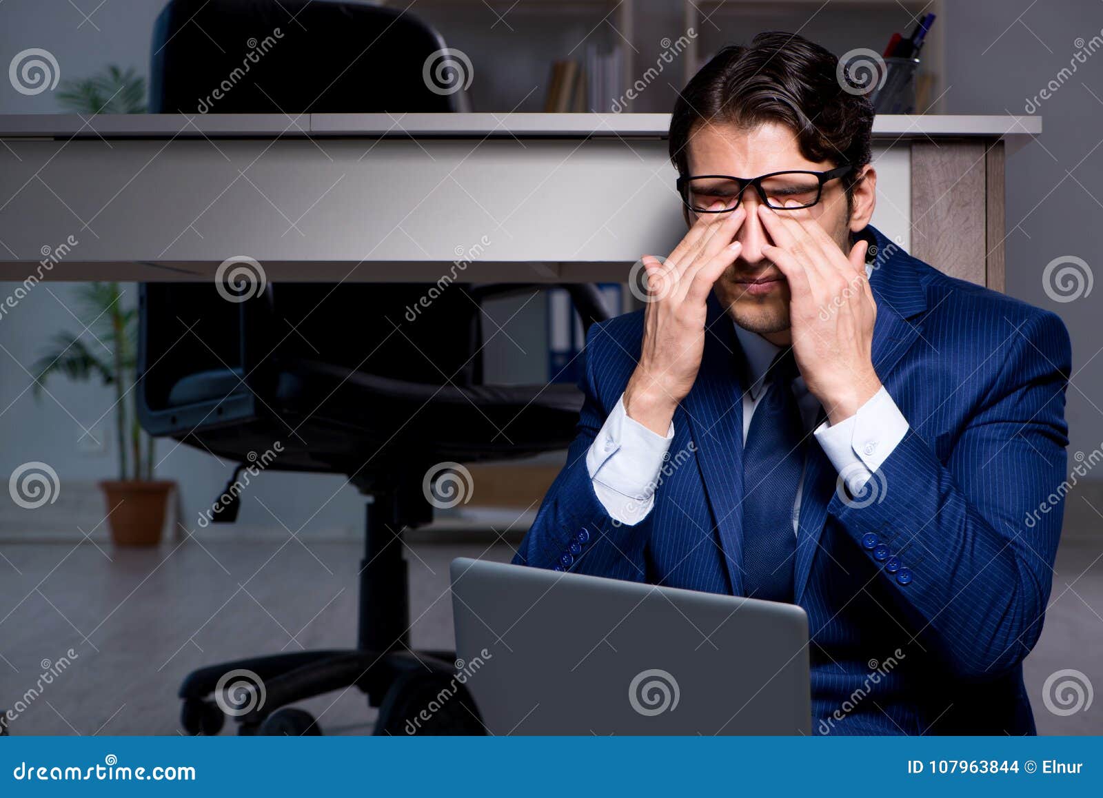 The Businessman Working Overtime Long Hours Late in Office Stock Photo ...
