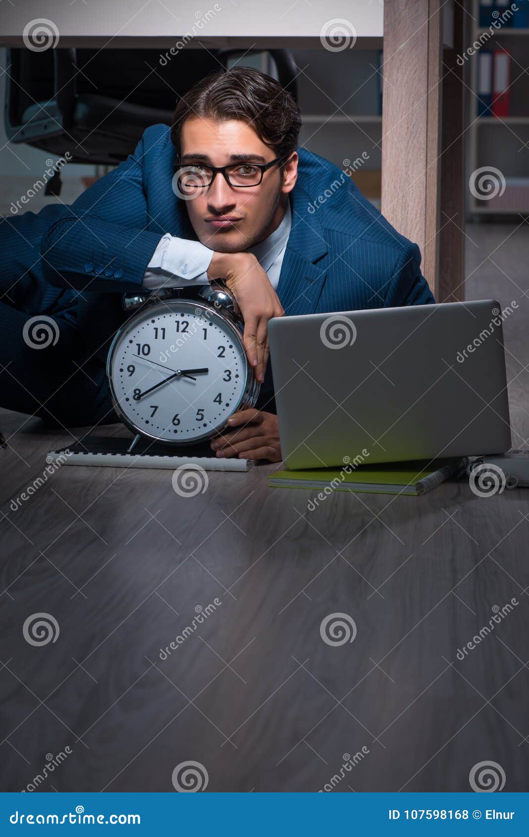 The Businessman Working Overtime Long Hours Late in Office Stock Photo ... The Businessman Working Overtime Long Hours Late in Office Stock Photo ...