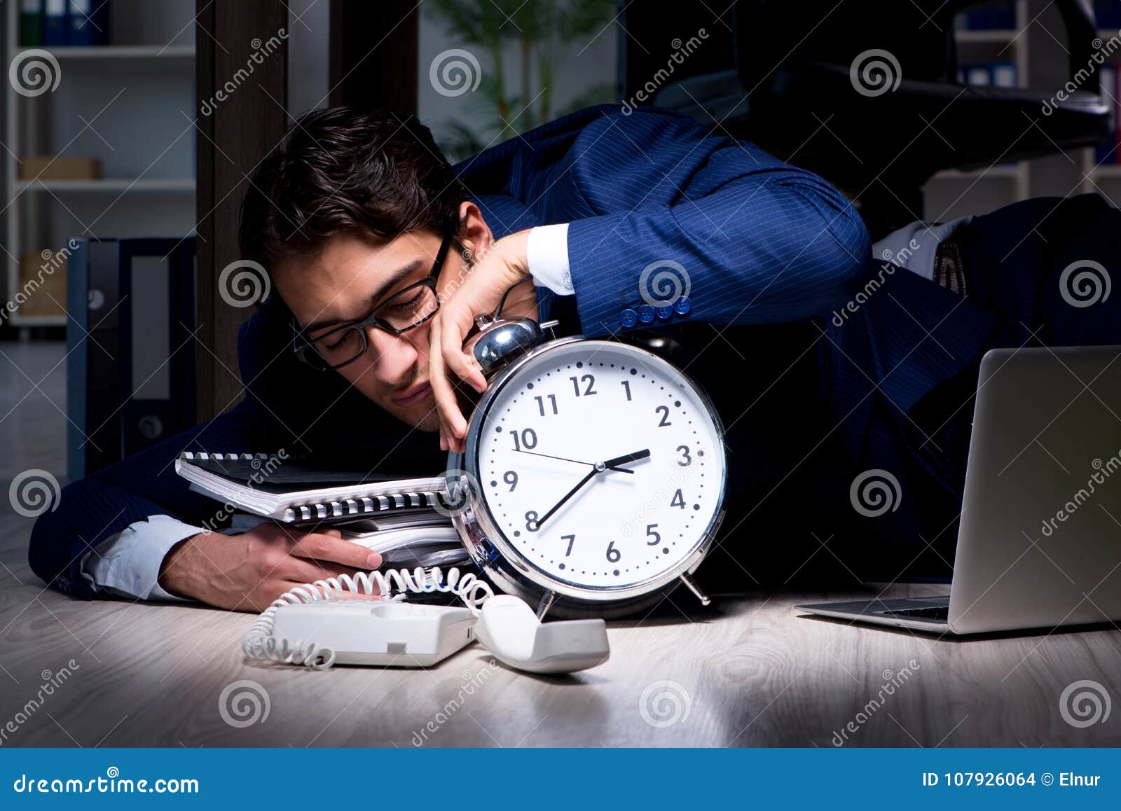 The Businessman Working Overtime Long Hours Late in Office Stock Photo ... The Businessman Working Overtime Long Hours Late in Office Stock Photo ...