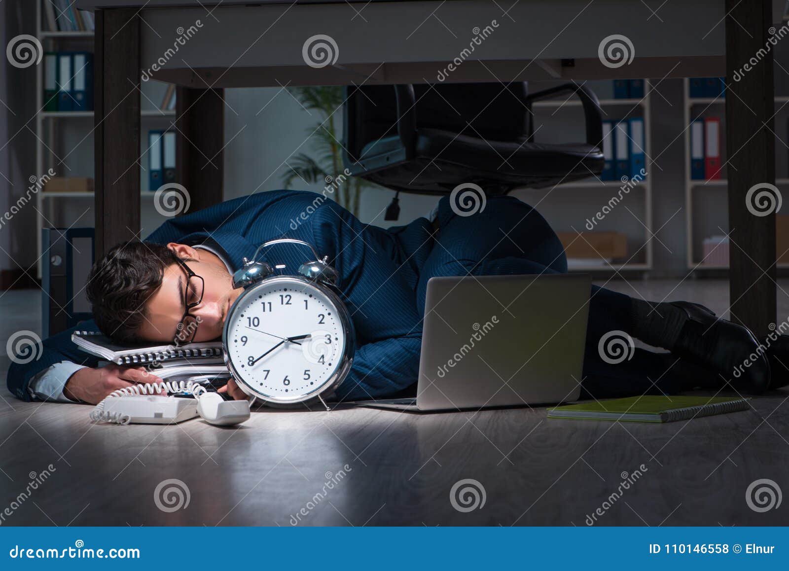 The Businessman Working Overtime Long Hours Late in Office Stock Photo ... The Businessman Working Overtime Long Hours Late in Office Stock Photo ...