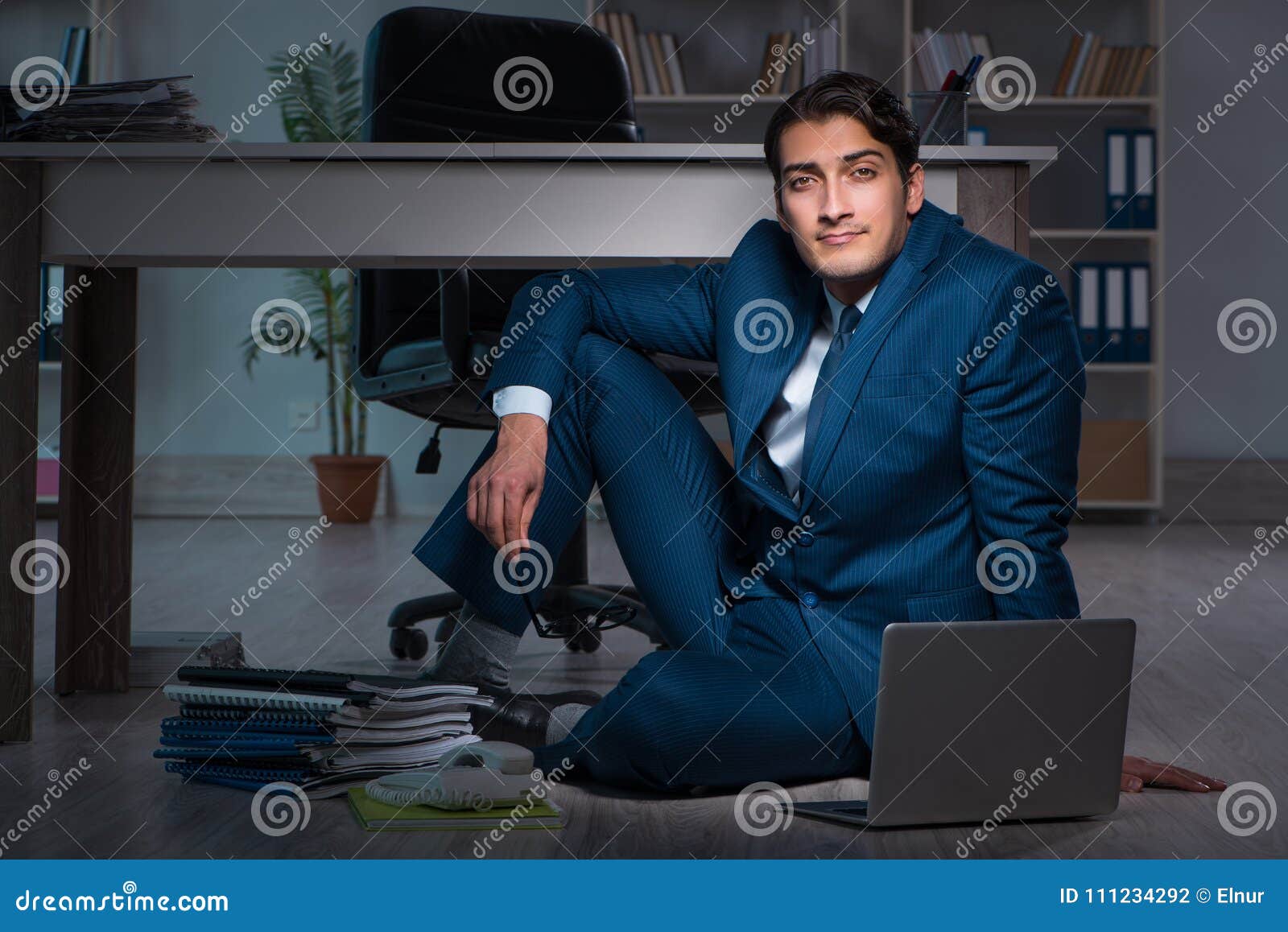 The Businessman Working Overtime Long Hours Late in Office Stock Photo ... The Businessman Working Overtime Long Hours Late in Office Stock Photo ...