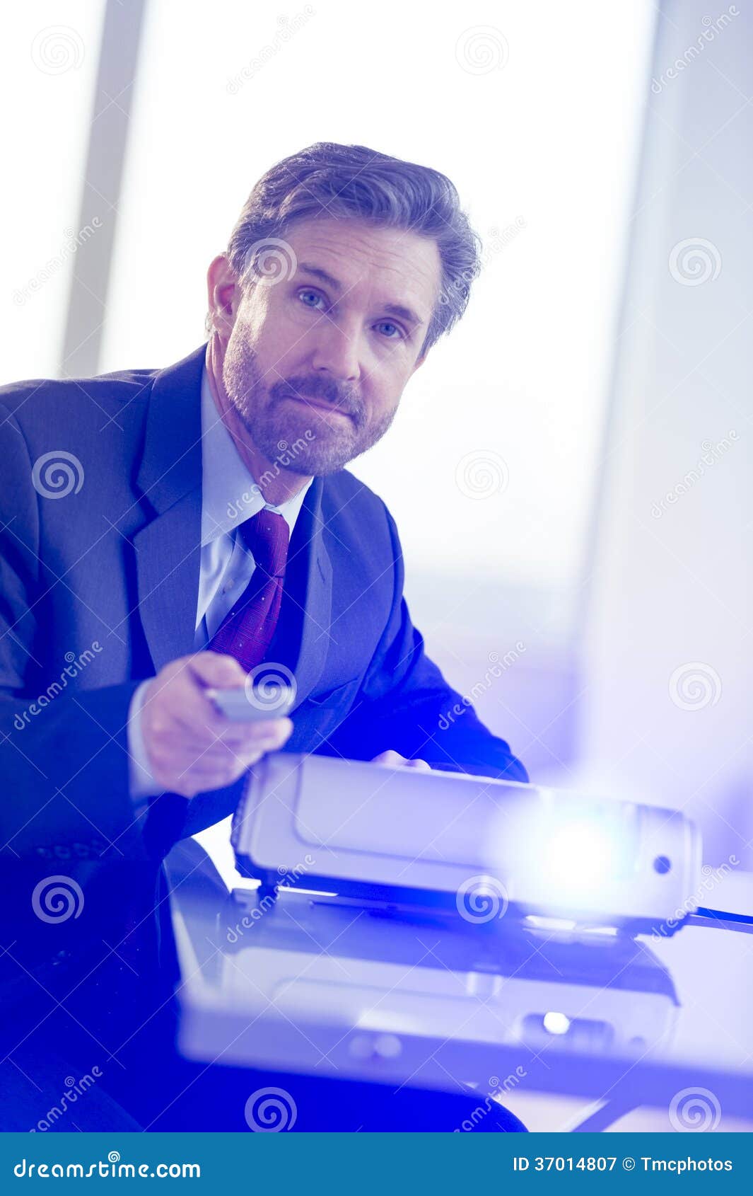 Businessman Working with Projector at Office Desk Stock Image - Image ...