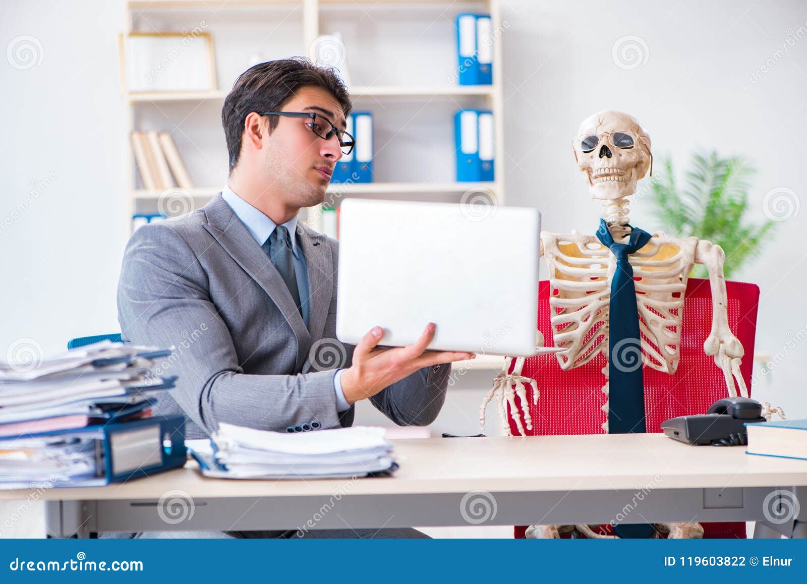 The Businessman Working with Skeleton in Office Stock Photo - Image of ...