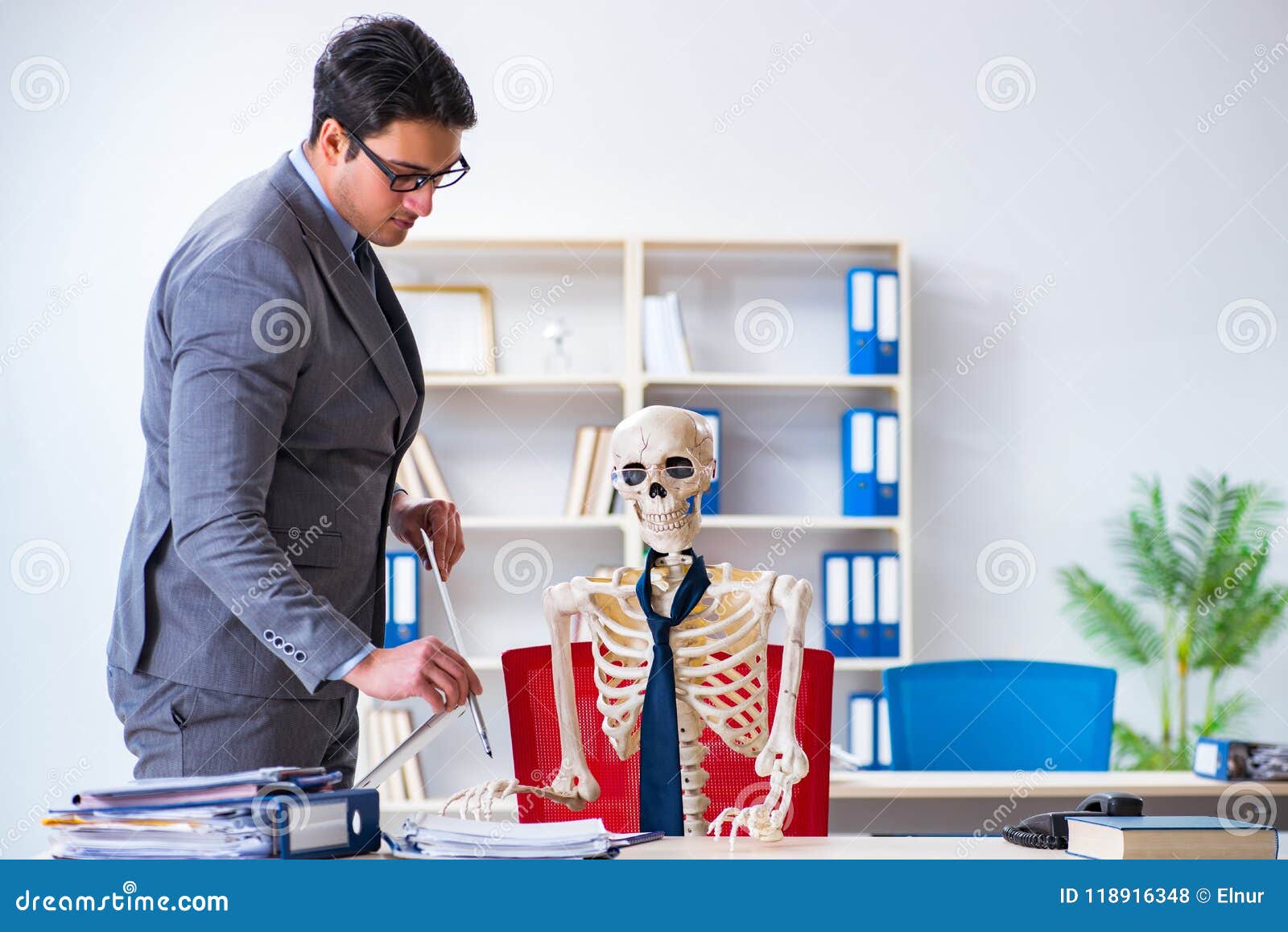 The Businessman Working with Skeleton in Office Stock Photo - Image of ...