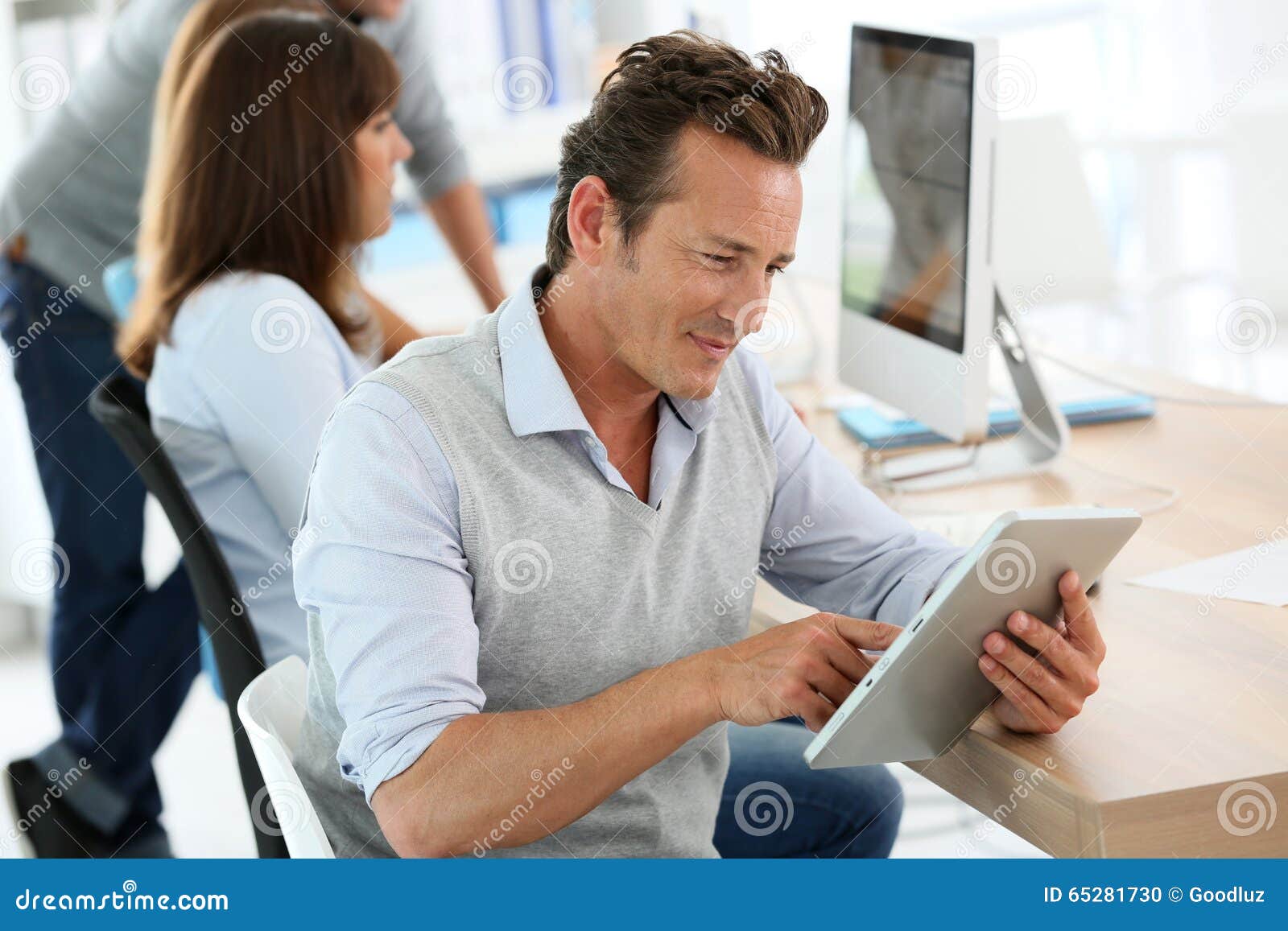 Businessman Working on Tablet at Office Stock Photo - Image of tablet ...