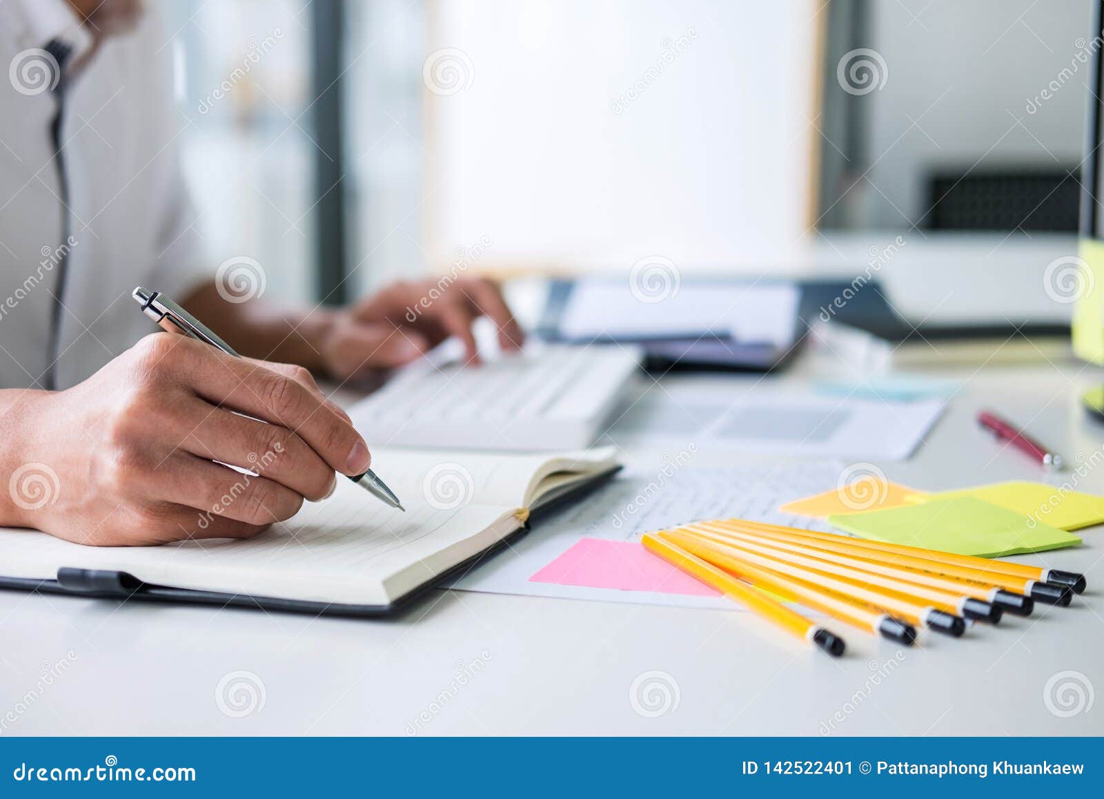 Businessman Working Writing Business Plan Document and Graphic Designer ...