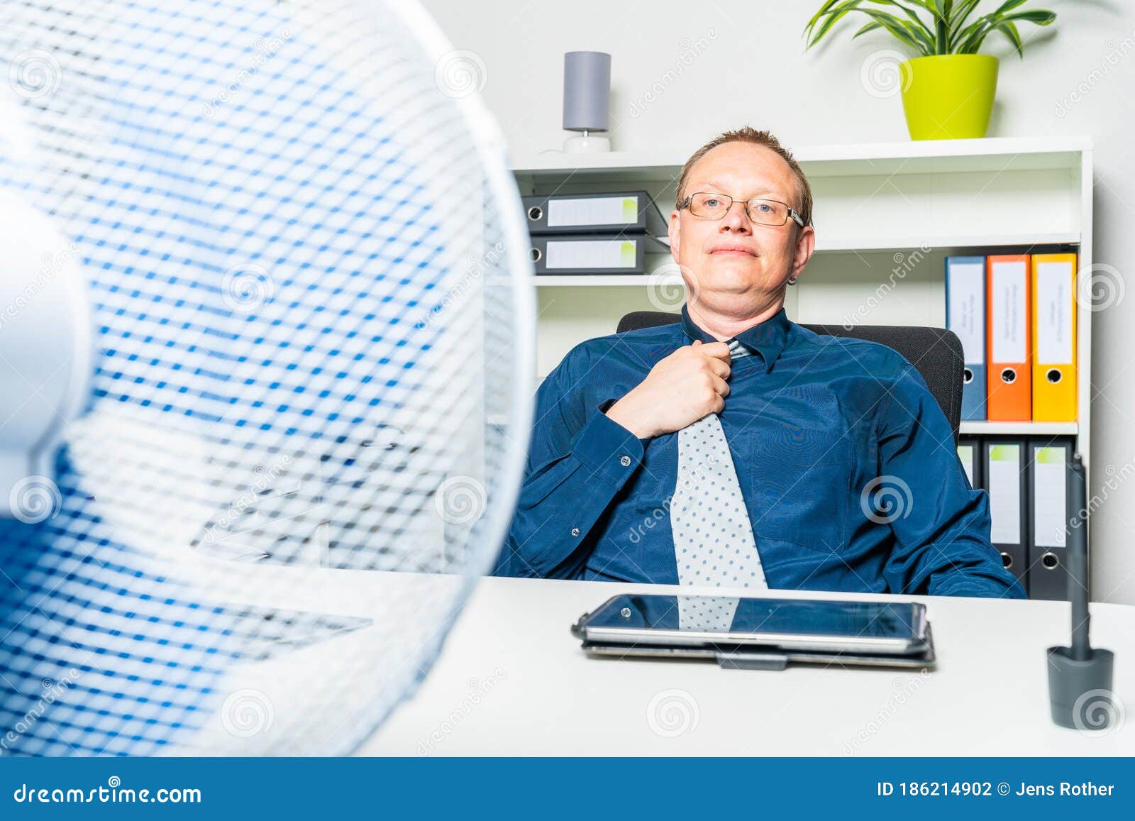 Businessman Works during a Heat Wave in the Office Stock Photo - Image ...