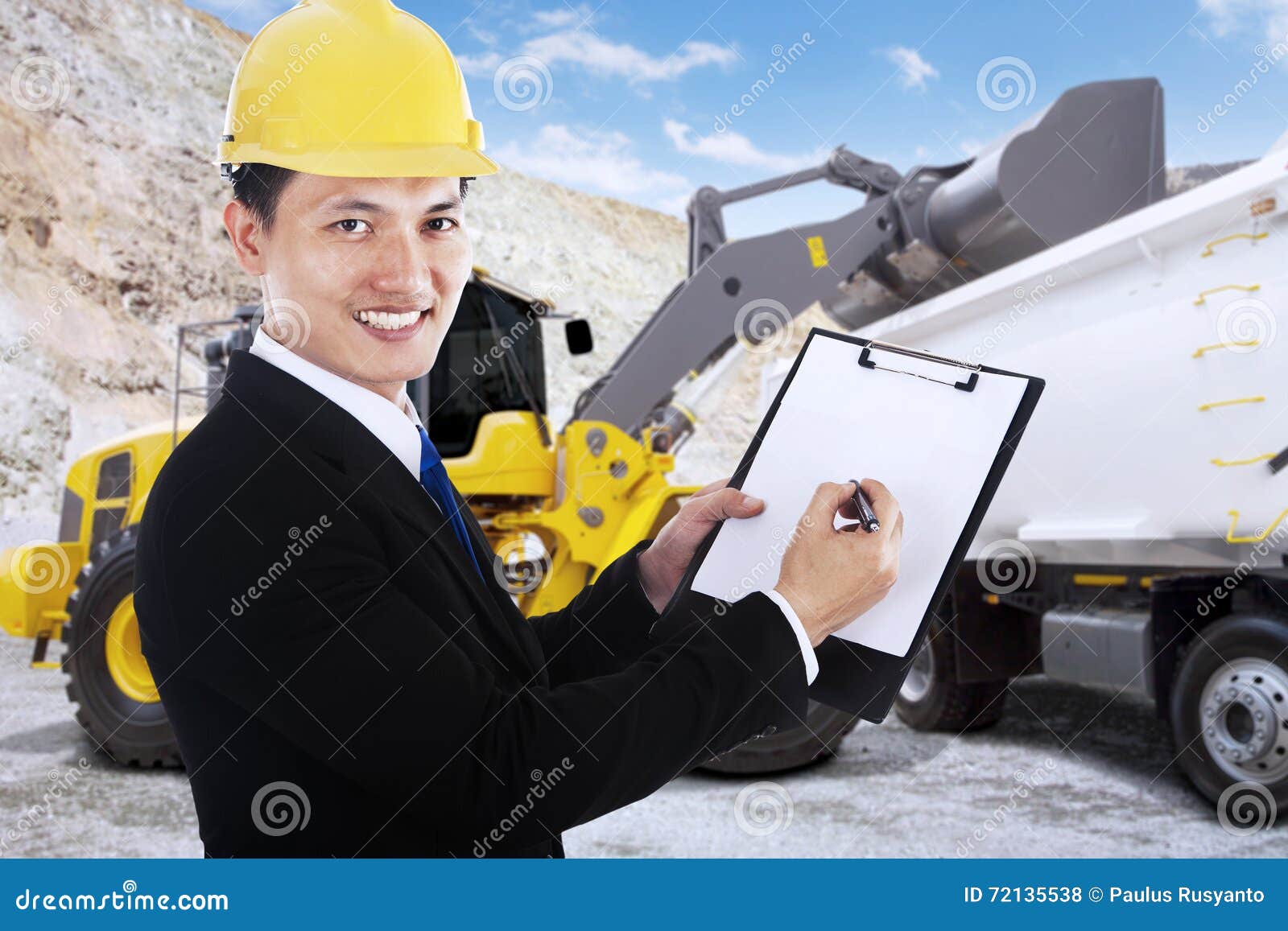 Businessman Writes on a Clipboard at Mining Site Stock Photo - Image of ...