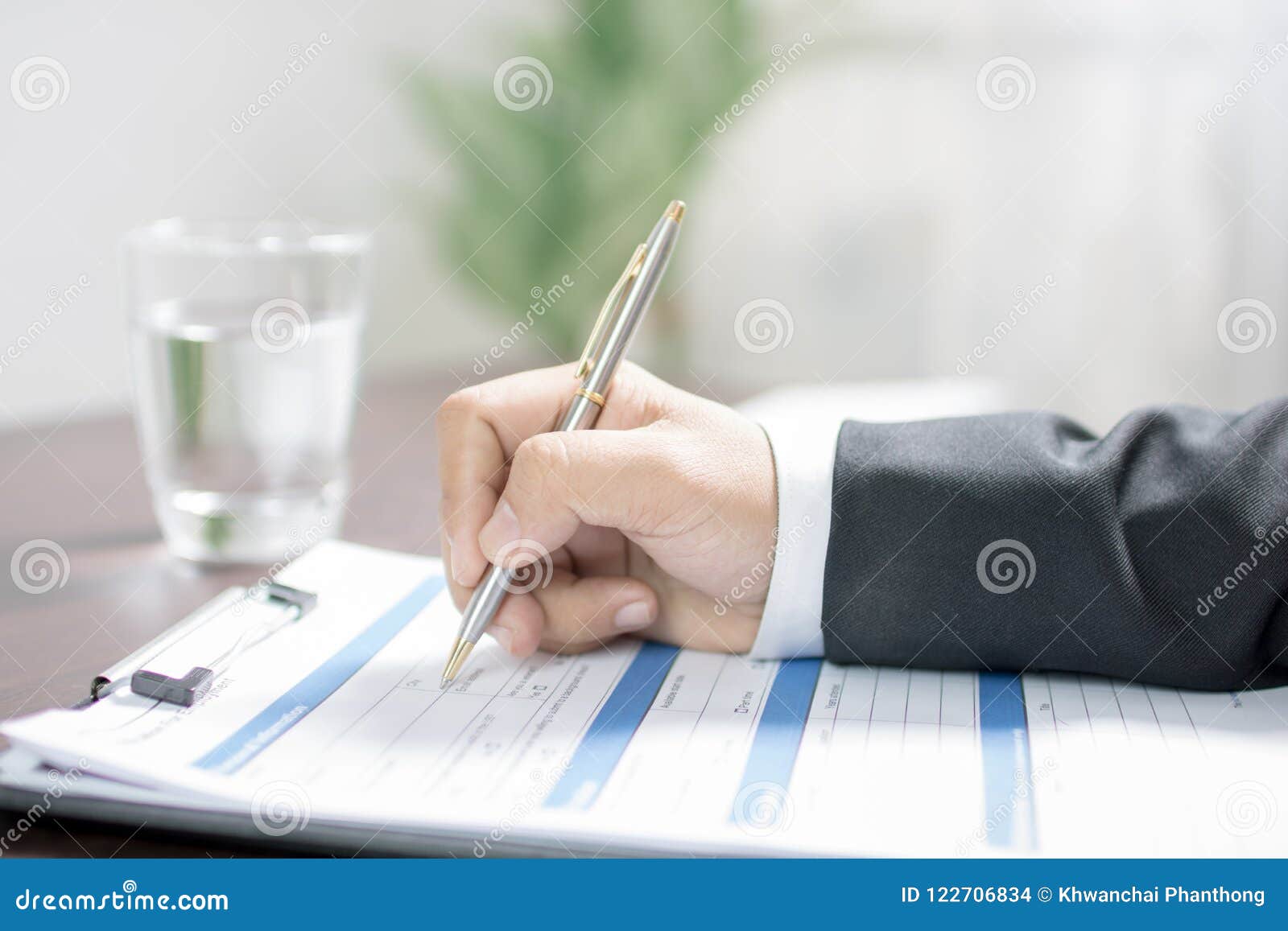 Businessman Writing on Application Form or Writing Information Stock ...