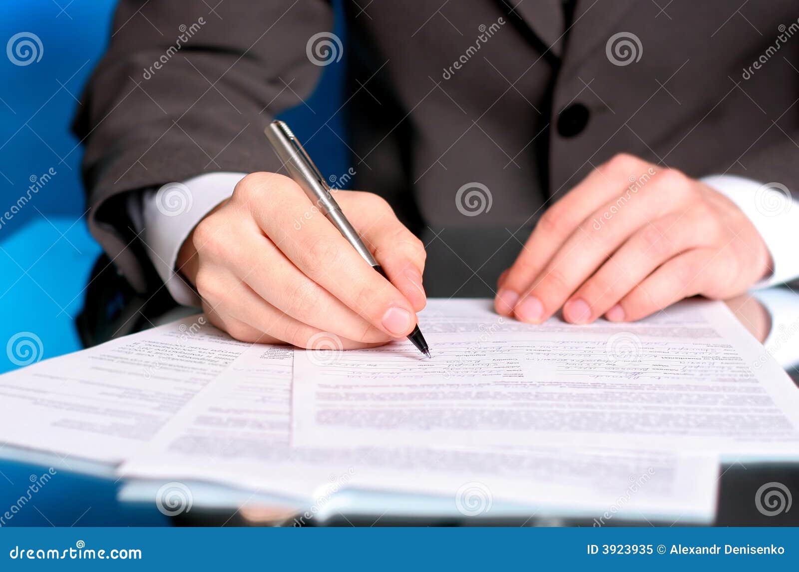 Businessman Writing on a Form Stock Image - Image of form, banking: 3923935